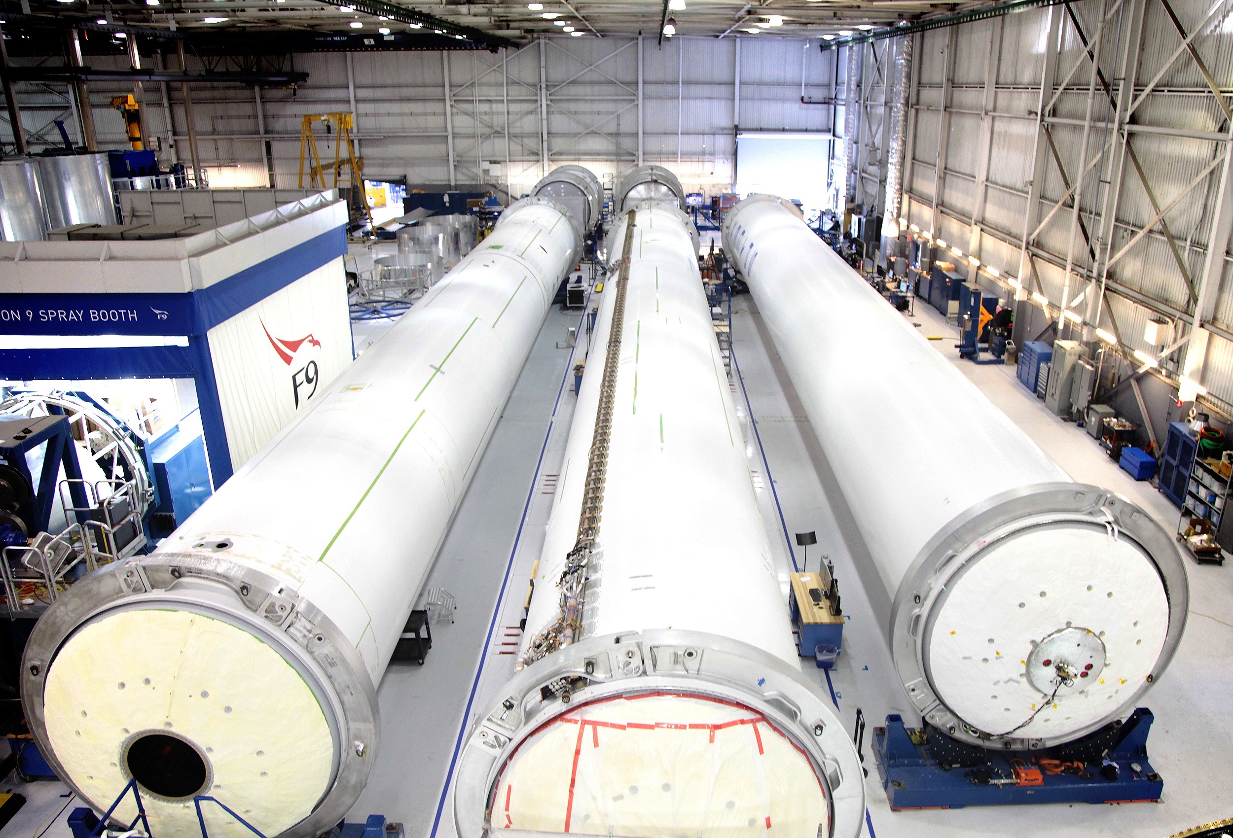 Long, white rocket tanks in the hangar free image download