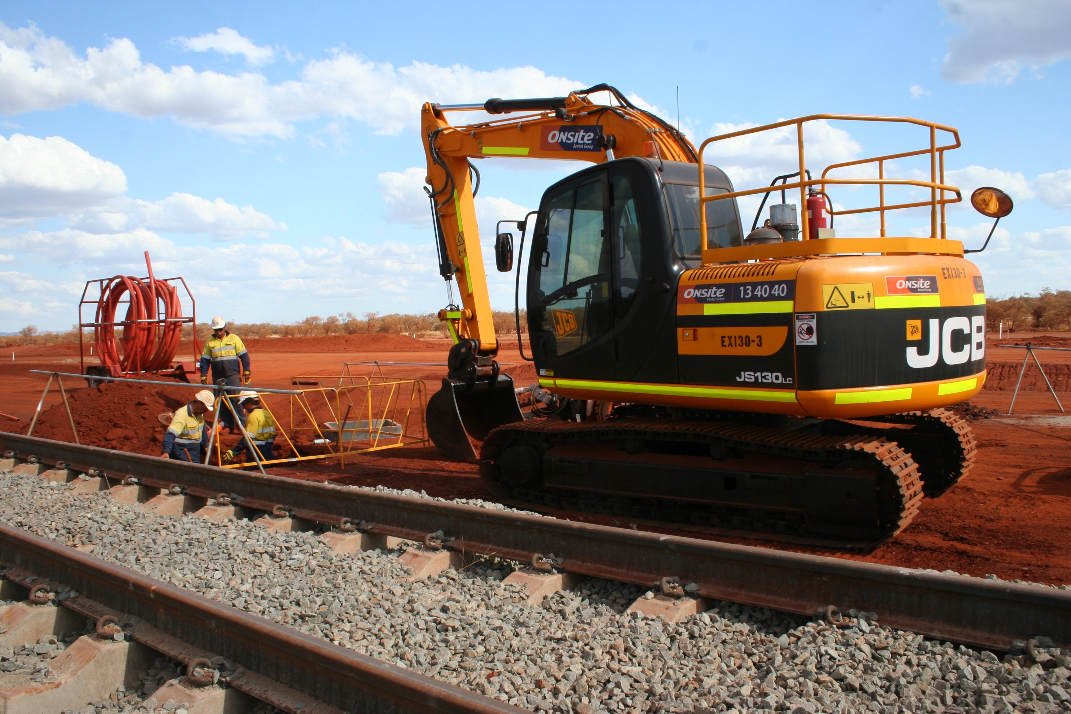 Excavator near the railroad free image download