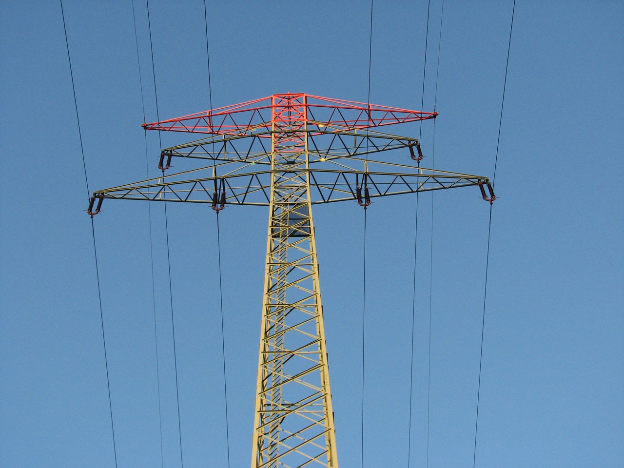 Tower with power lines on blue sky background free image download