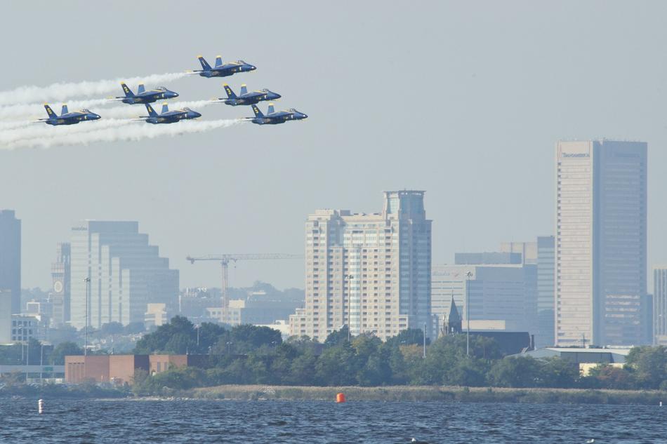 Beautiful, flying "Blue Angels" aircrafts, above the water, near the ...