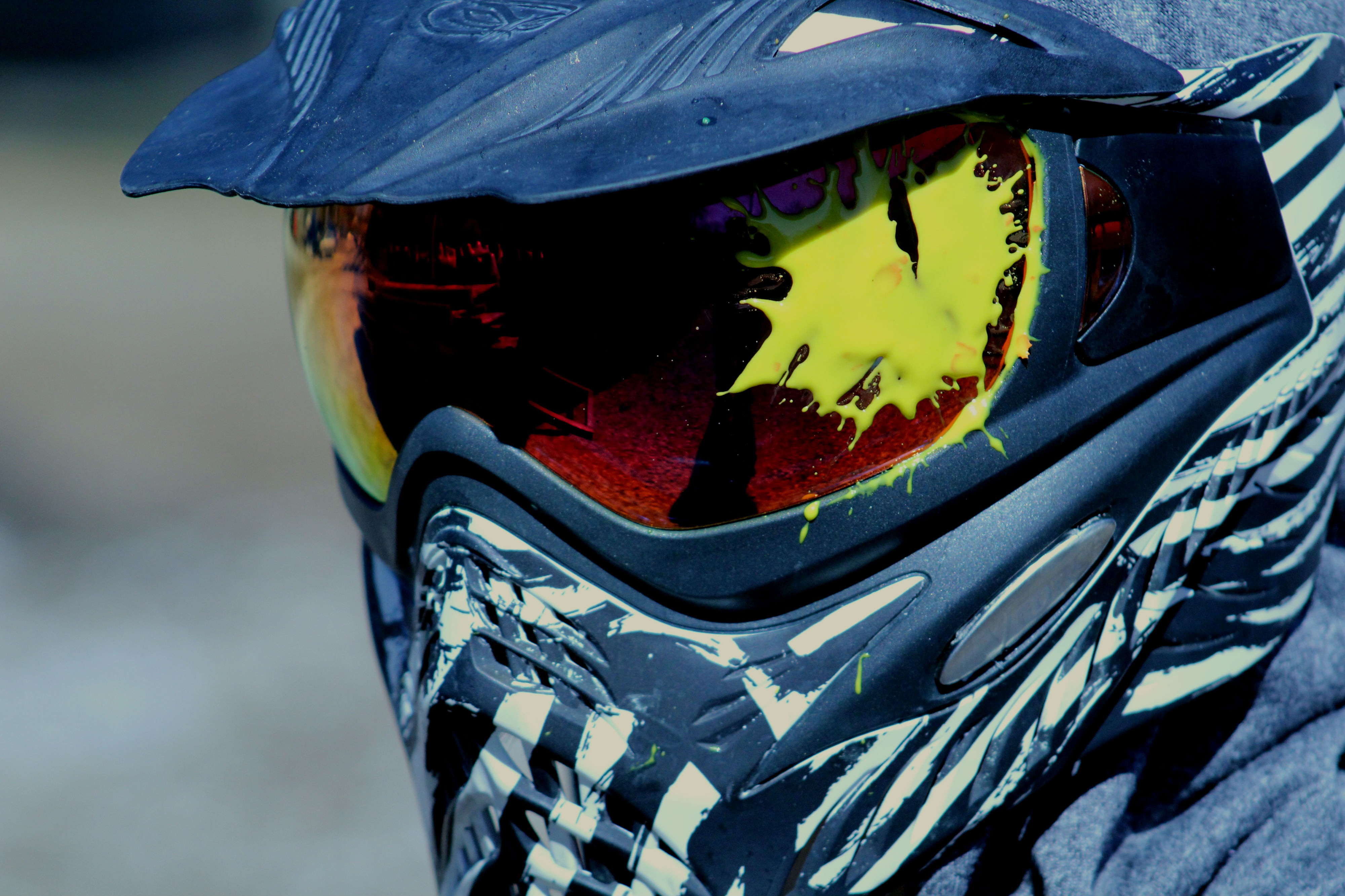 Paintball mask with colorful paint splashes free image download