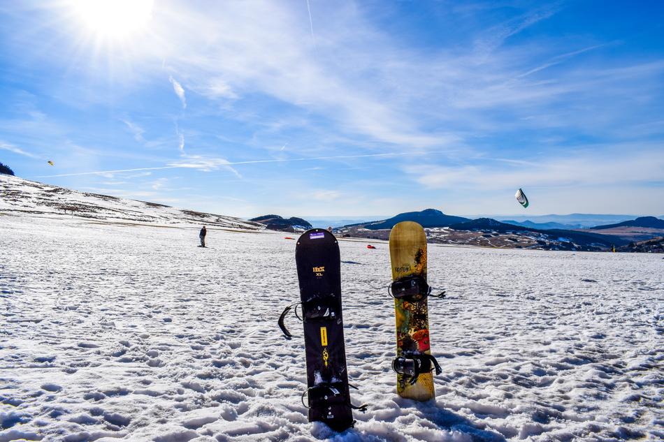 Colorful snowboards, on the beautiful snowy mountain with the person in ...