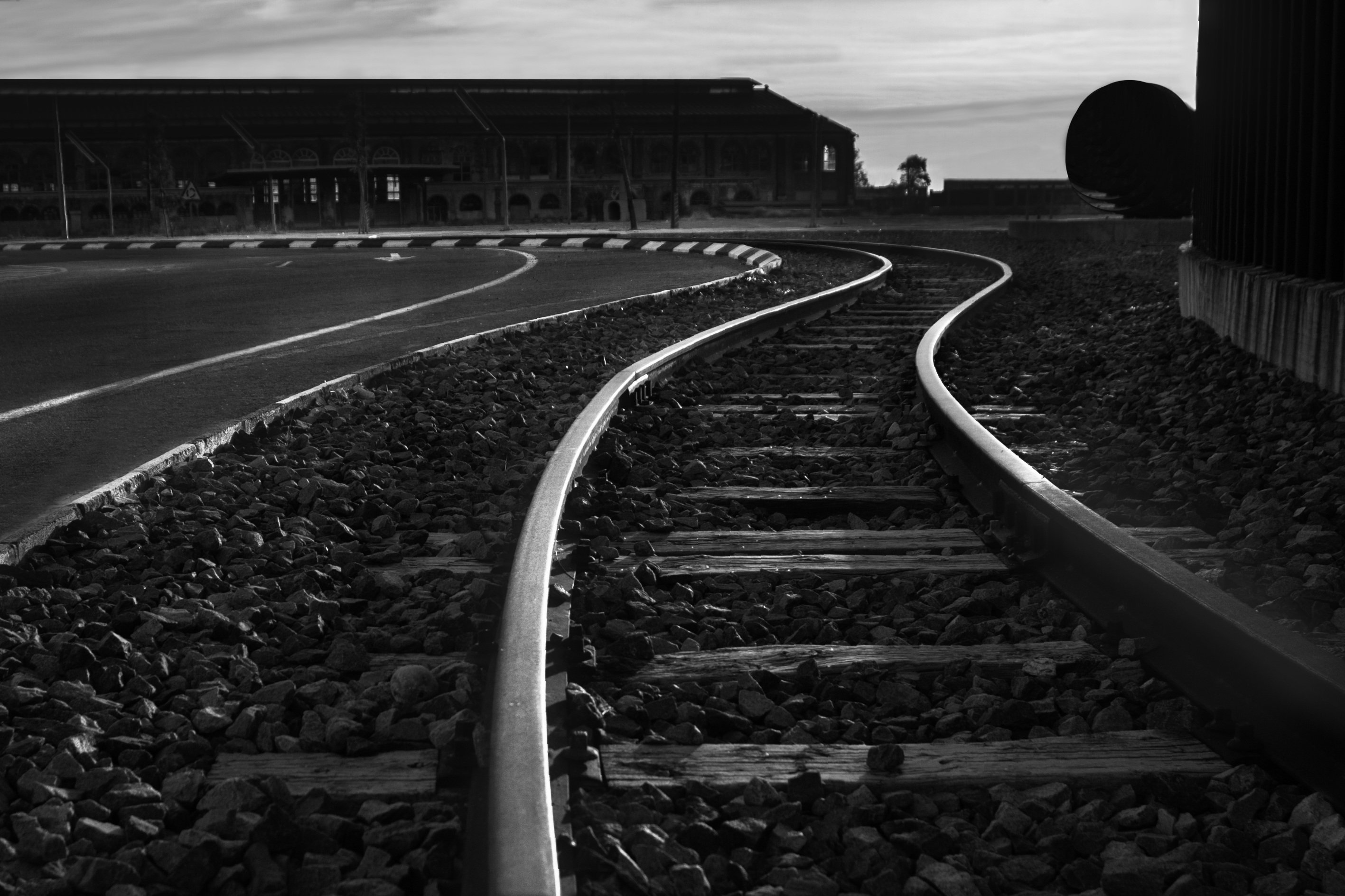 Railroad tracks near the highway free image download