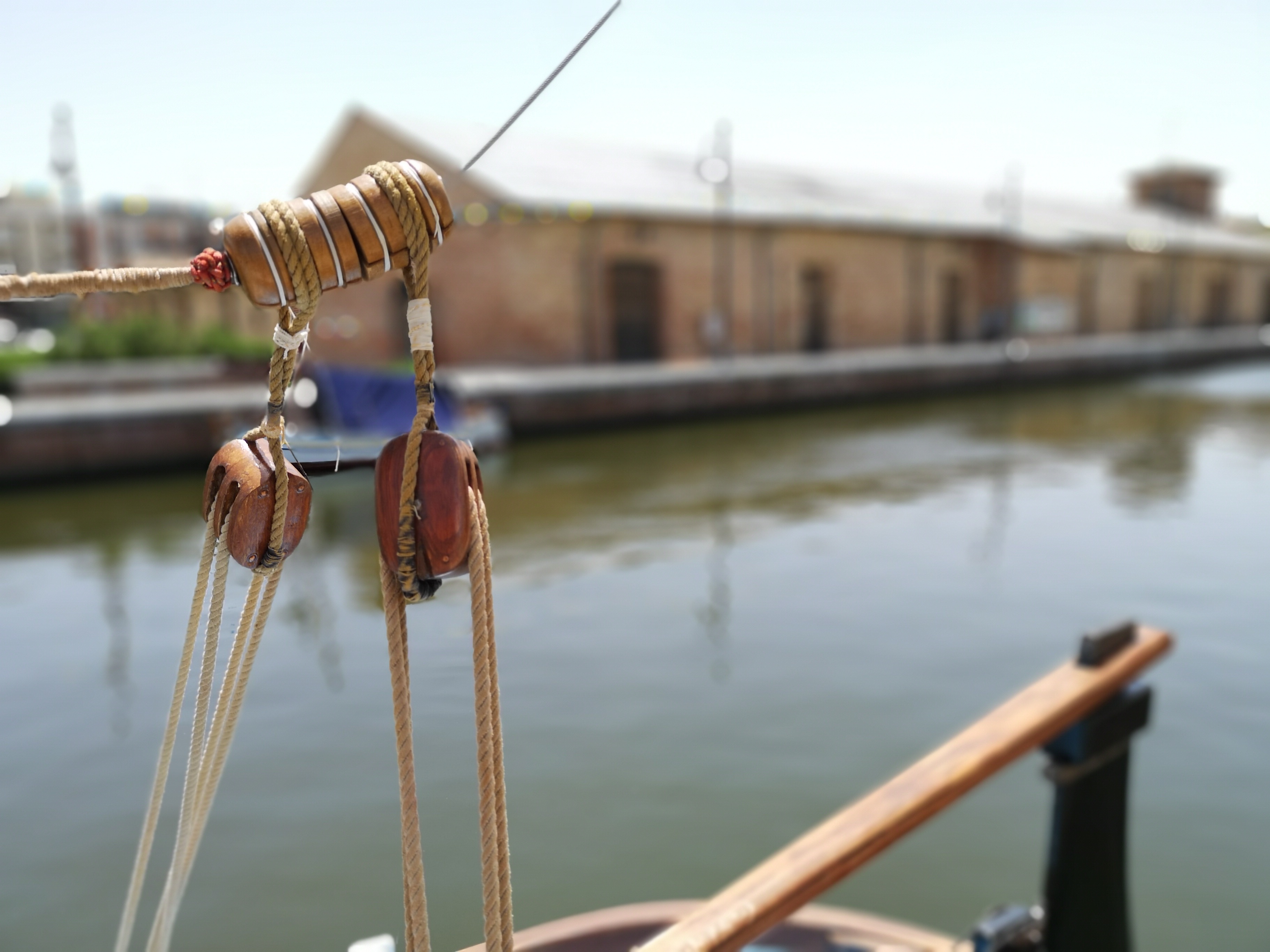 Close up Of The Canvas Ropes On The Ship In The Dock With Buildings