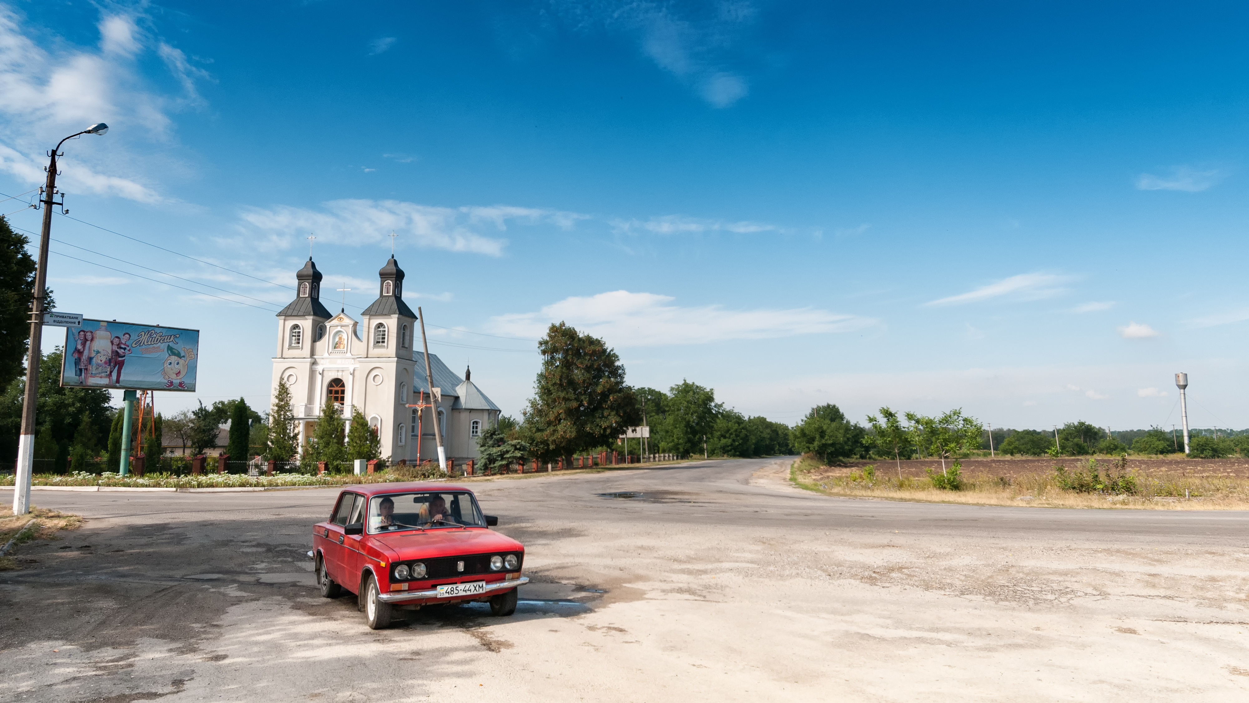 Red old car Lada on the road in Ukraine free image download
