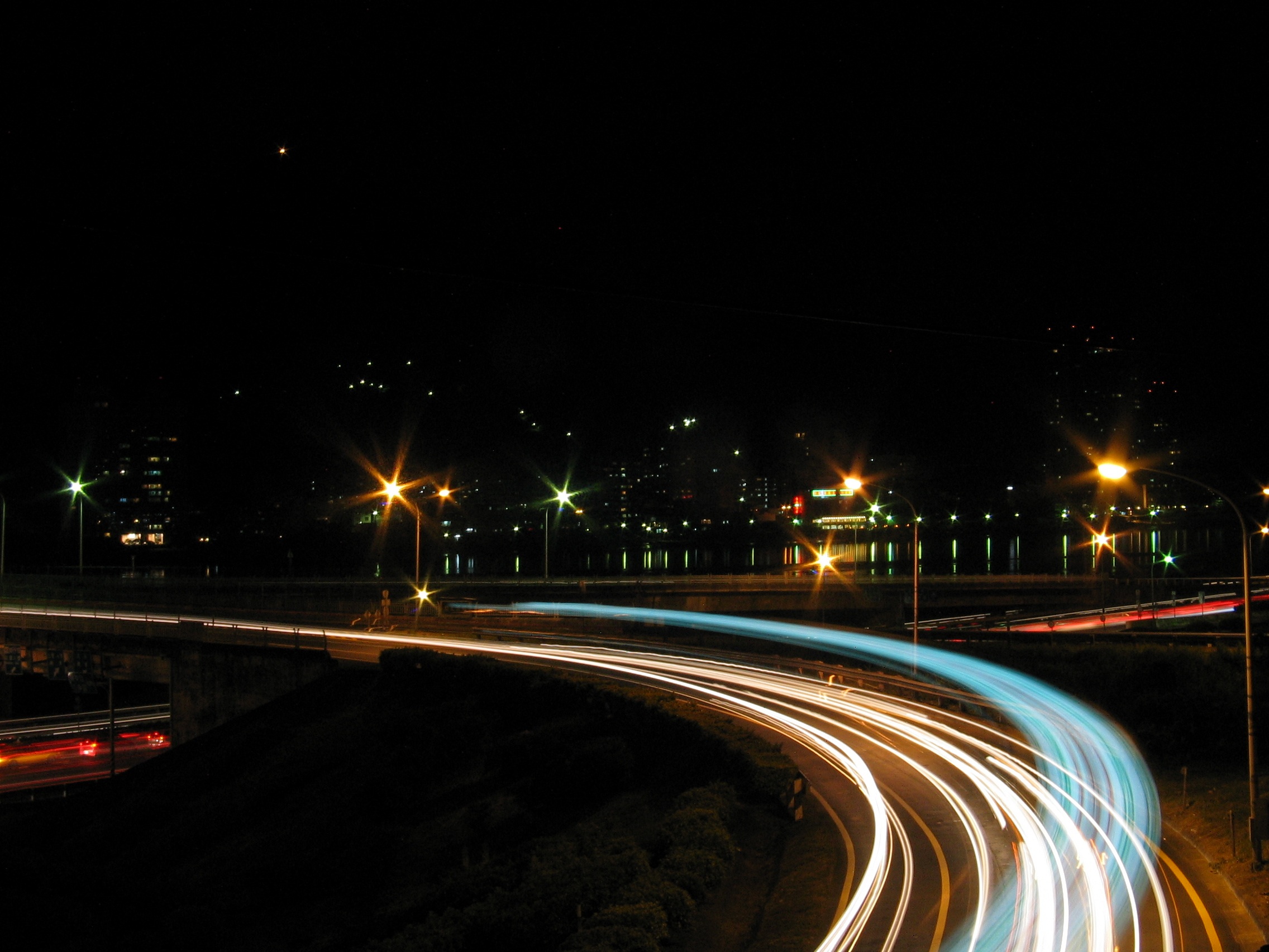 Colored lines of light on the road free image download