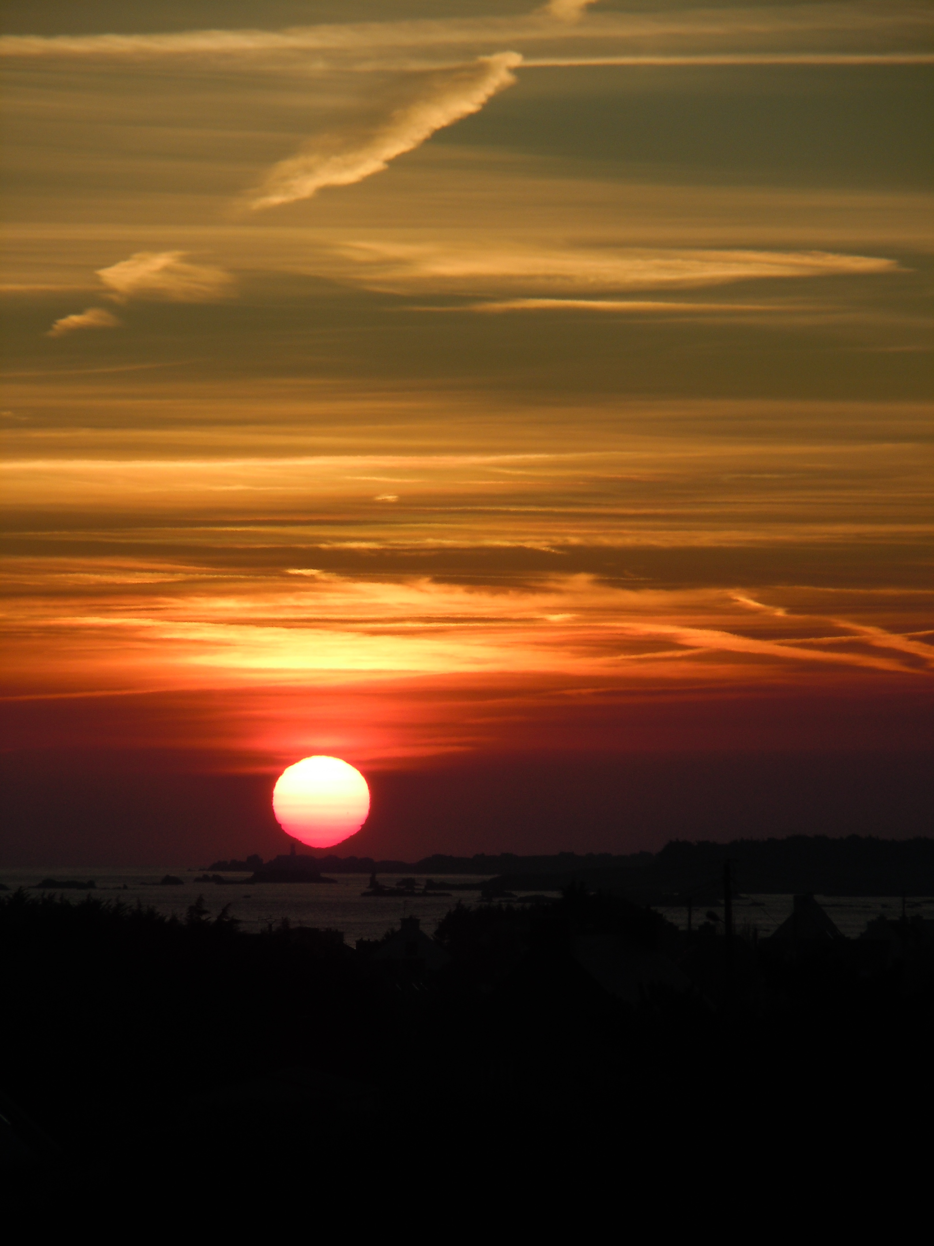 Sunset in the evening sky over the landscapes of brittany free image ...