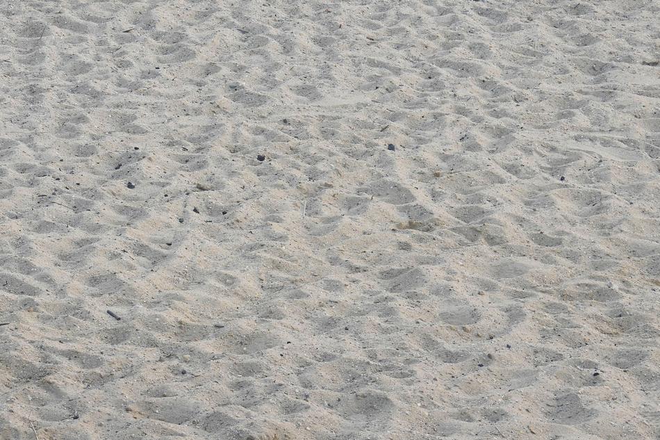 Sand Beach with grey Pebbles, textured background free image download