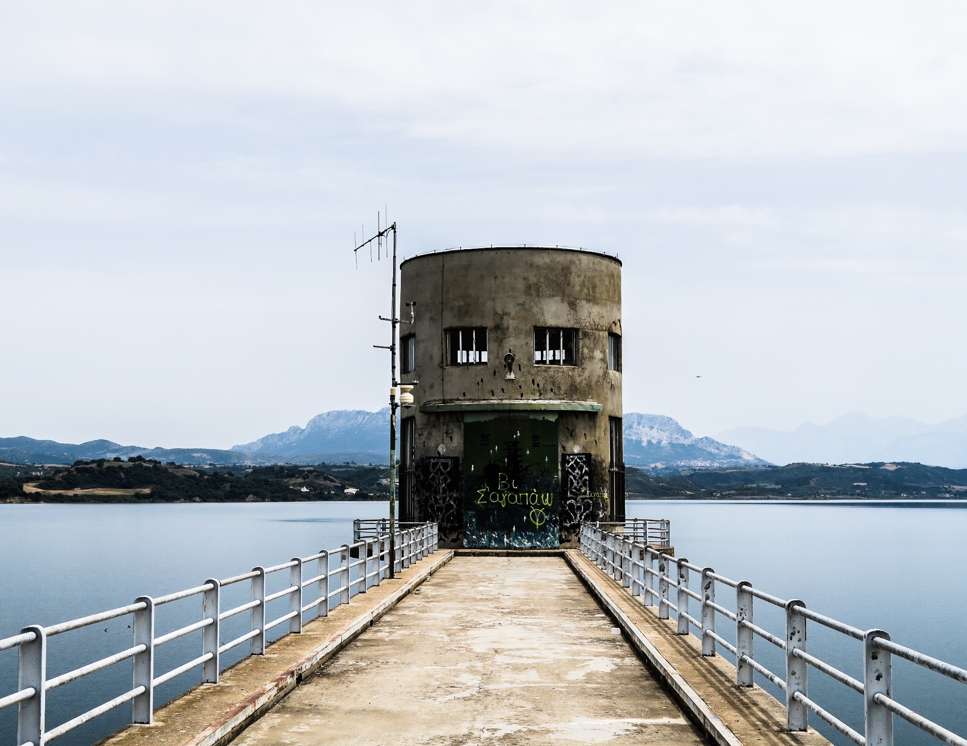 Old building and pier by sea free image download
