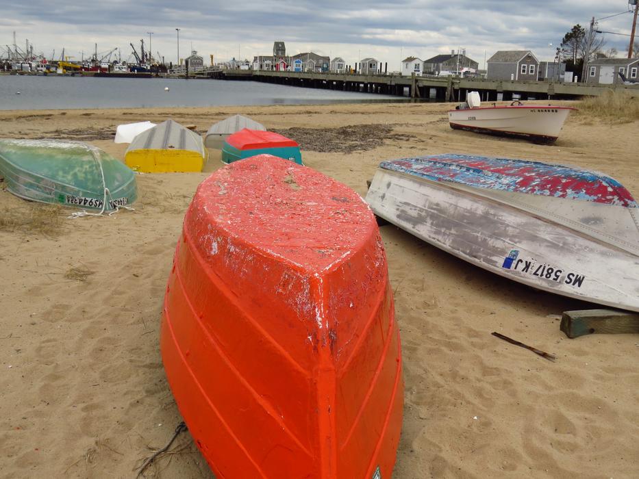 Small orange Boats on sand coast free image download