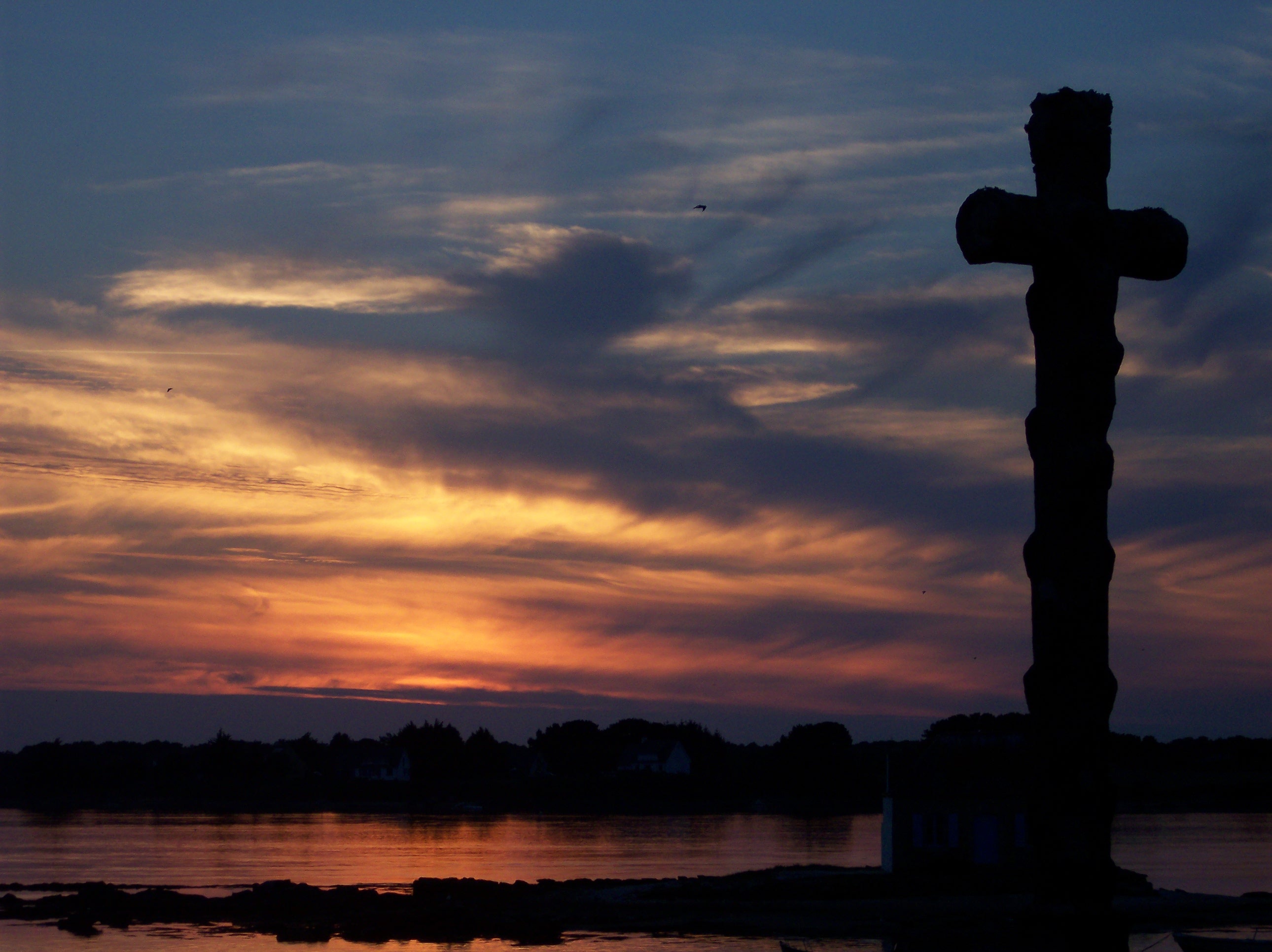 Cross by the lake at the sunset free image download