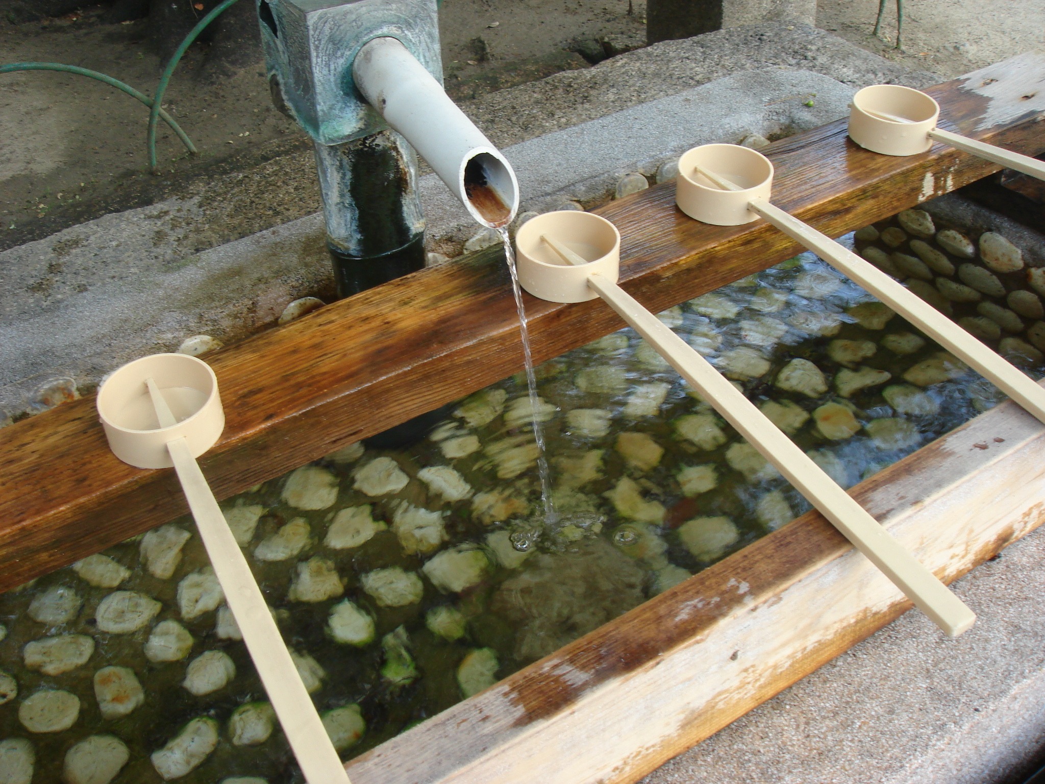 Sacred Water, wooden ladles at traditional asian fountain free image ...