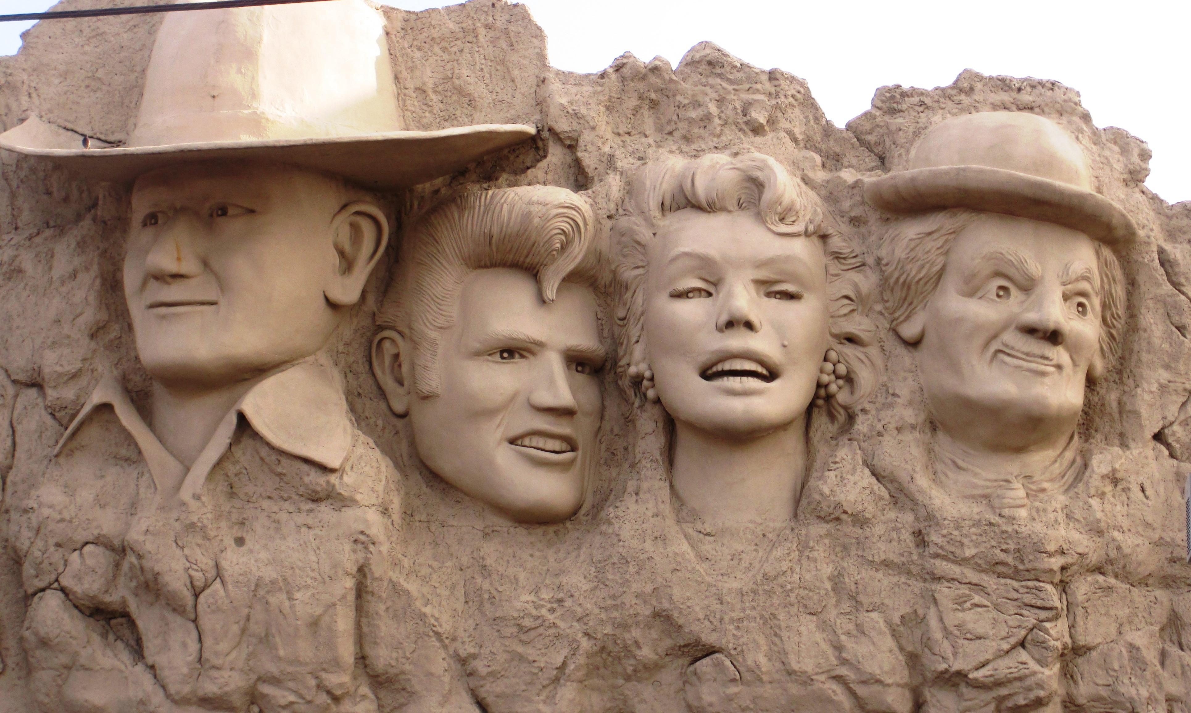 Hollywood celebrity Statues on Wall free image download
