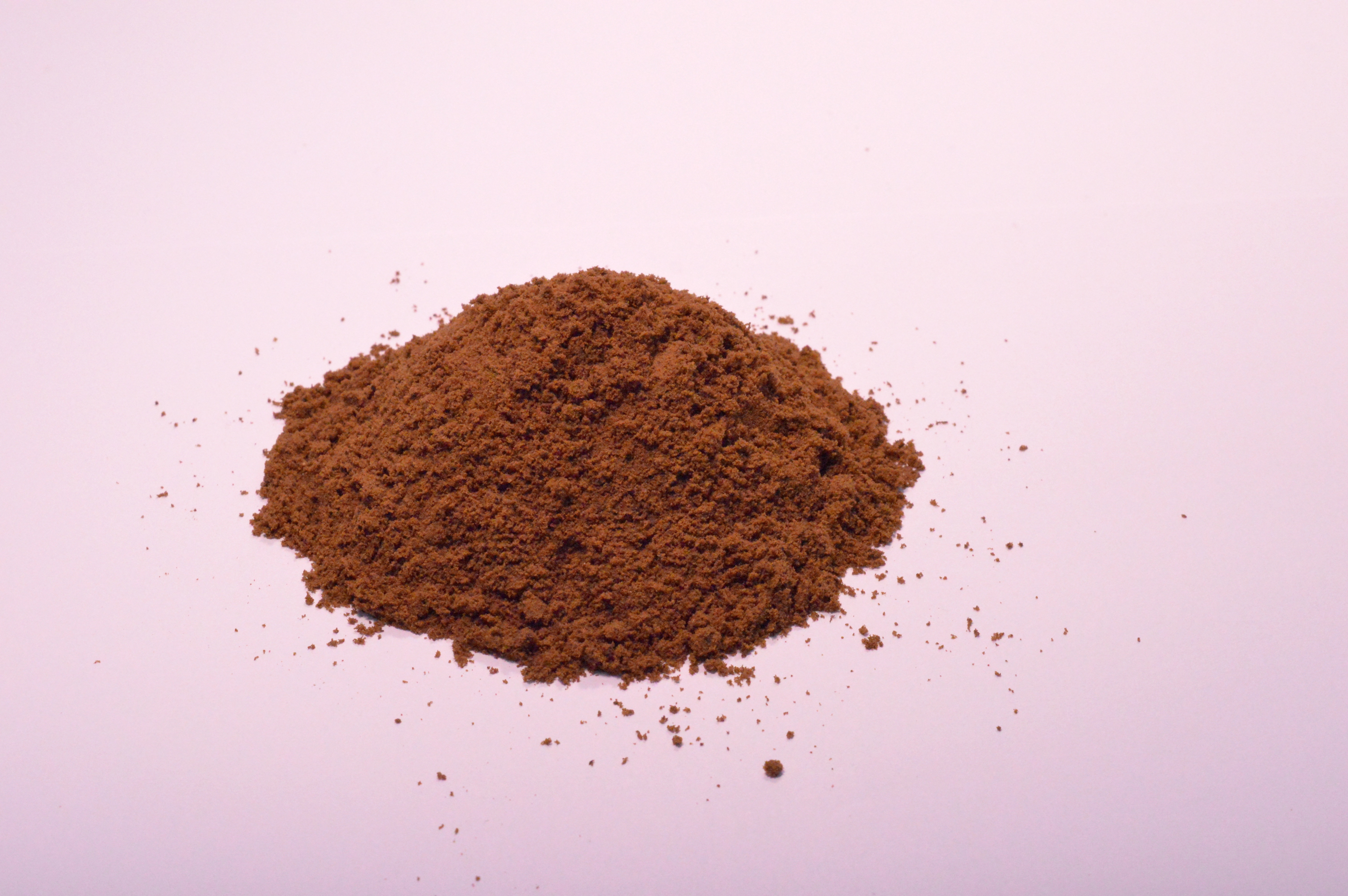 A handful of sand on a white background free image download