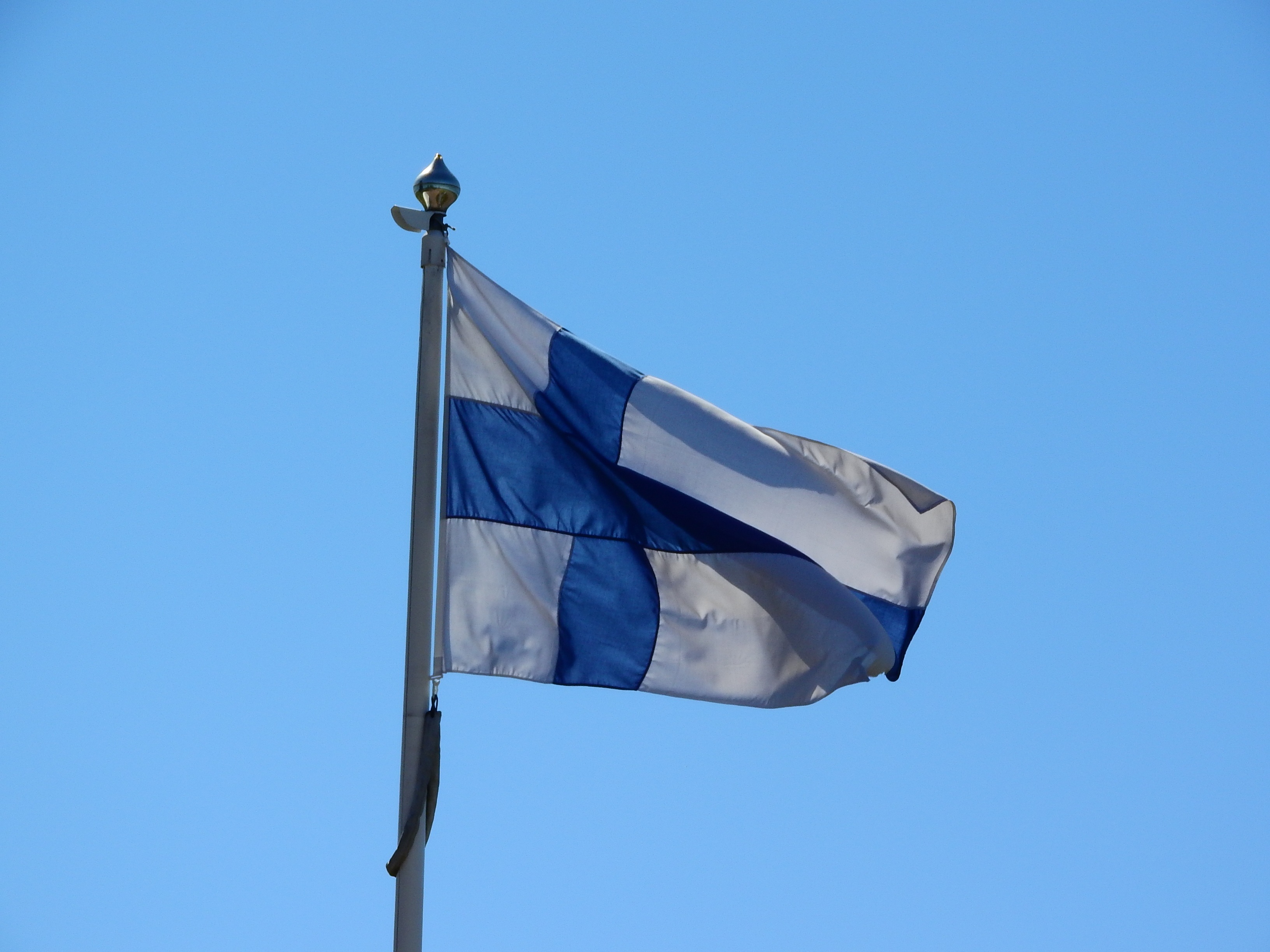 Flag flying in the wind in the sky free image download