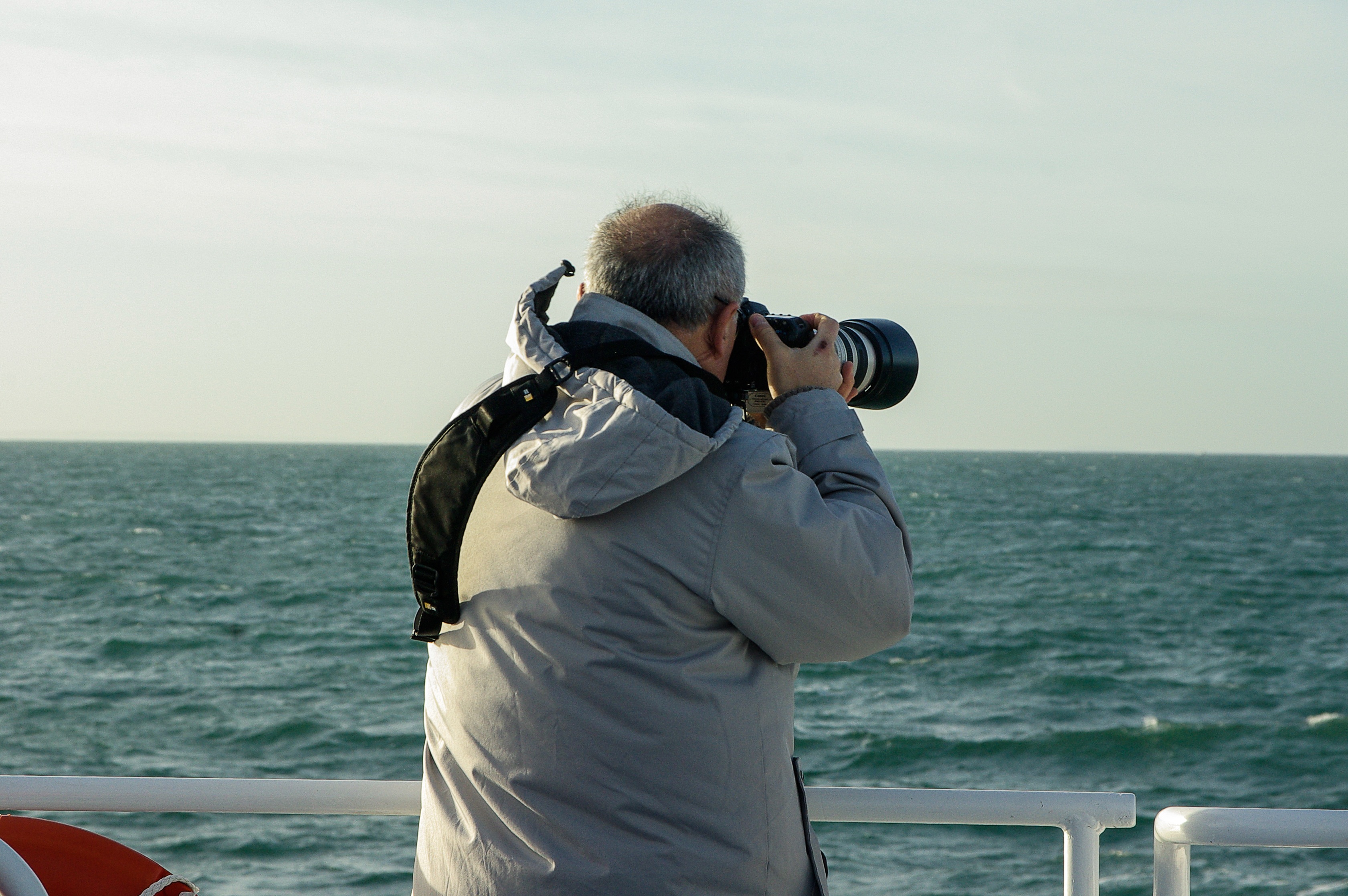 Photographer with camera on deck free image download