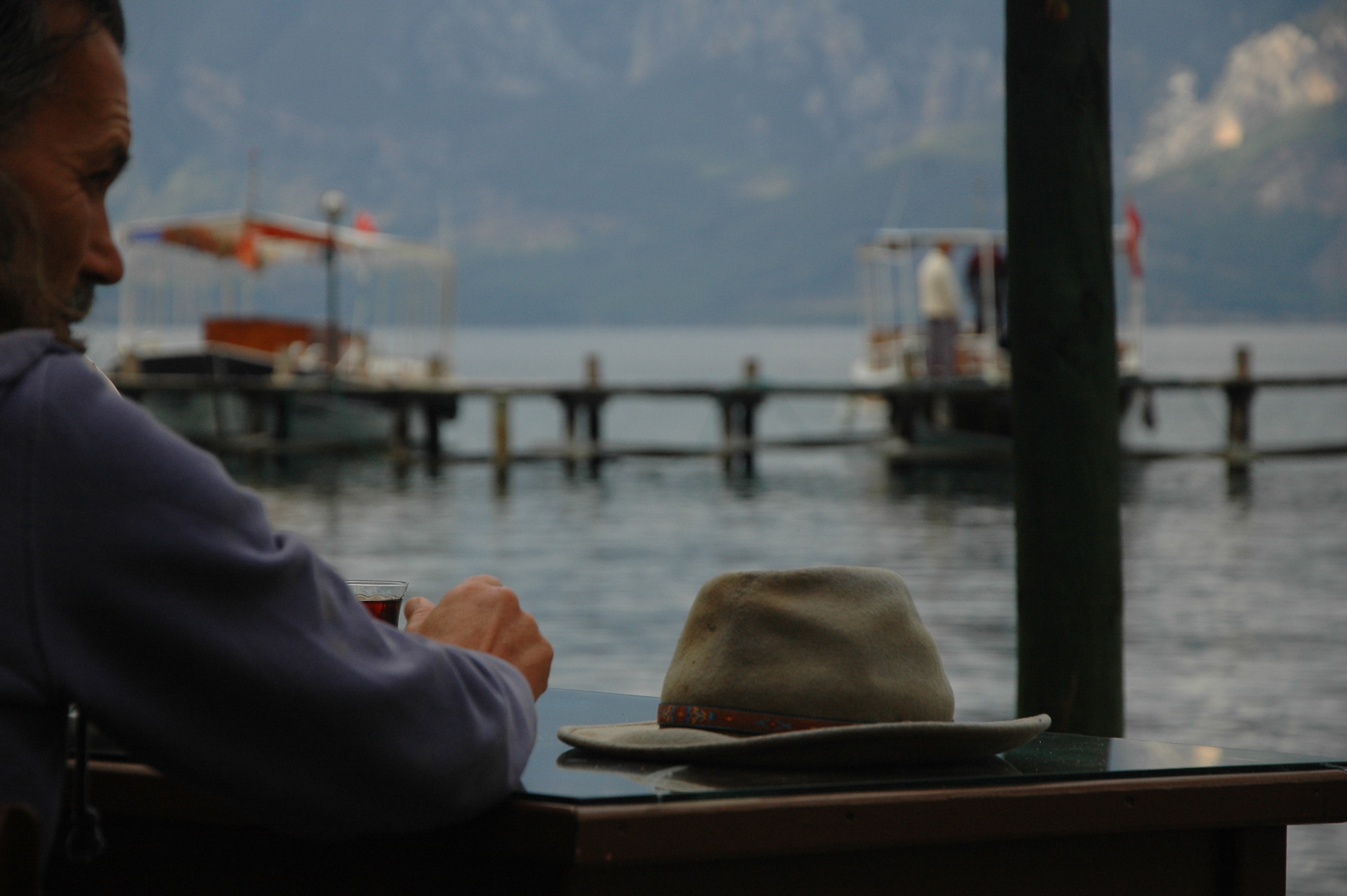 Man sitting with a view of the sea free image download