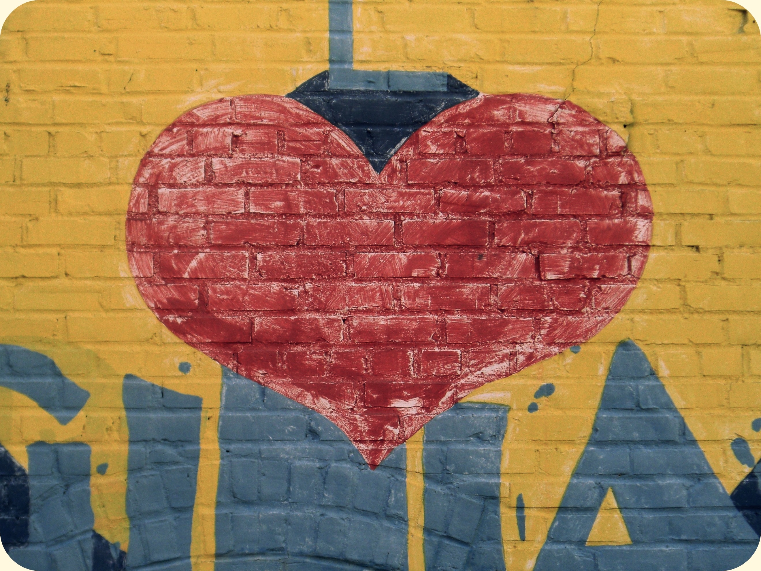 Heart brick yellow wall pait free image download