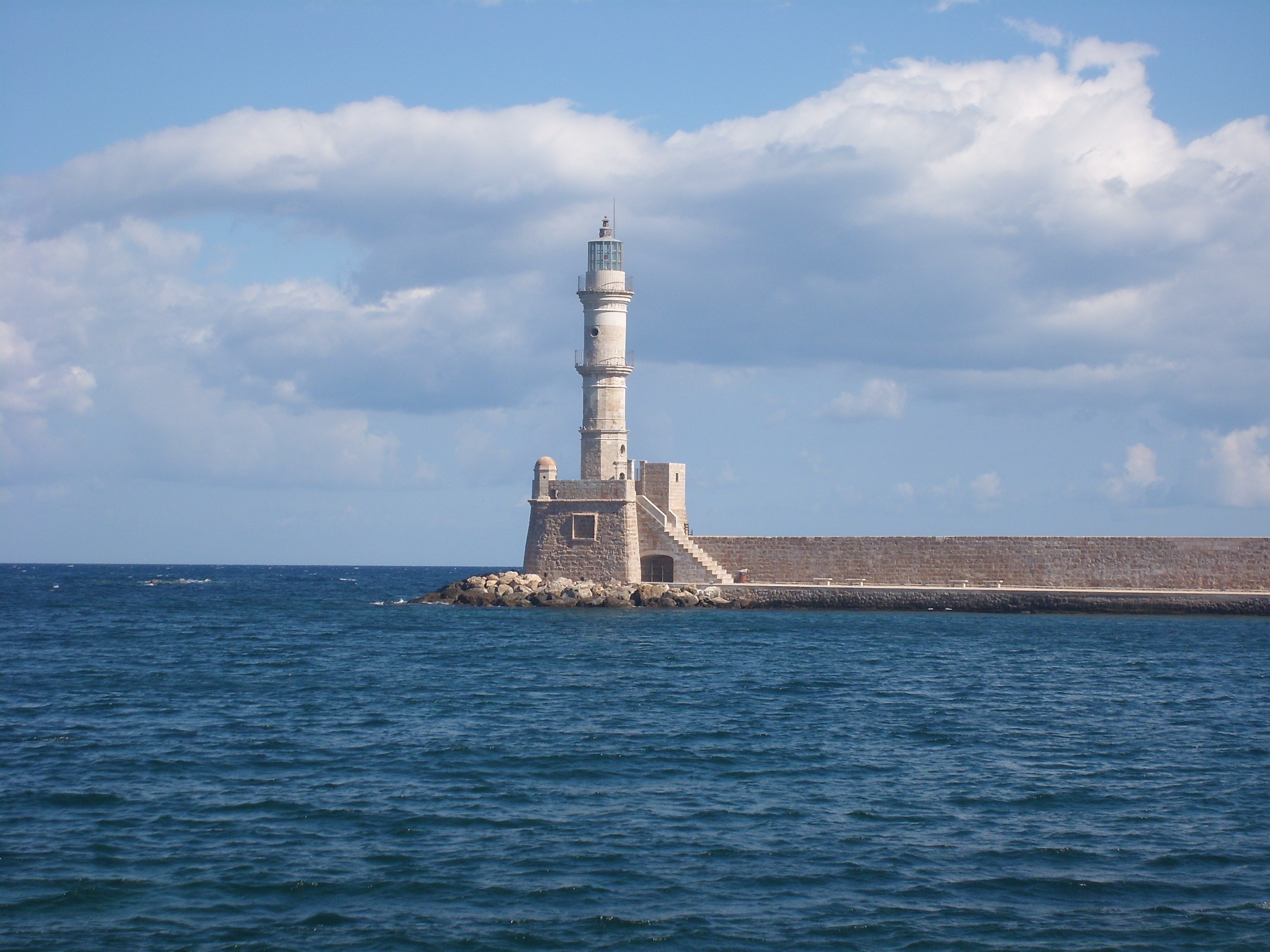 Beautiful white lighthouse by the sea free image download