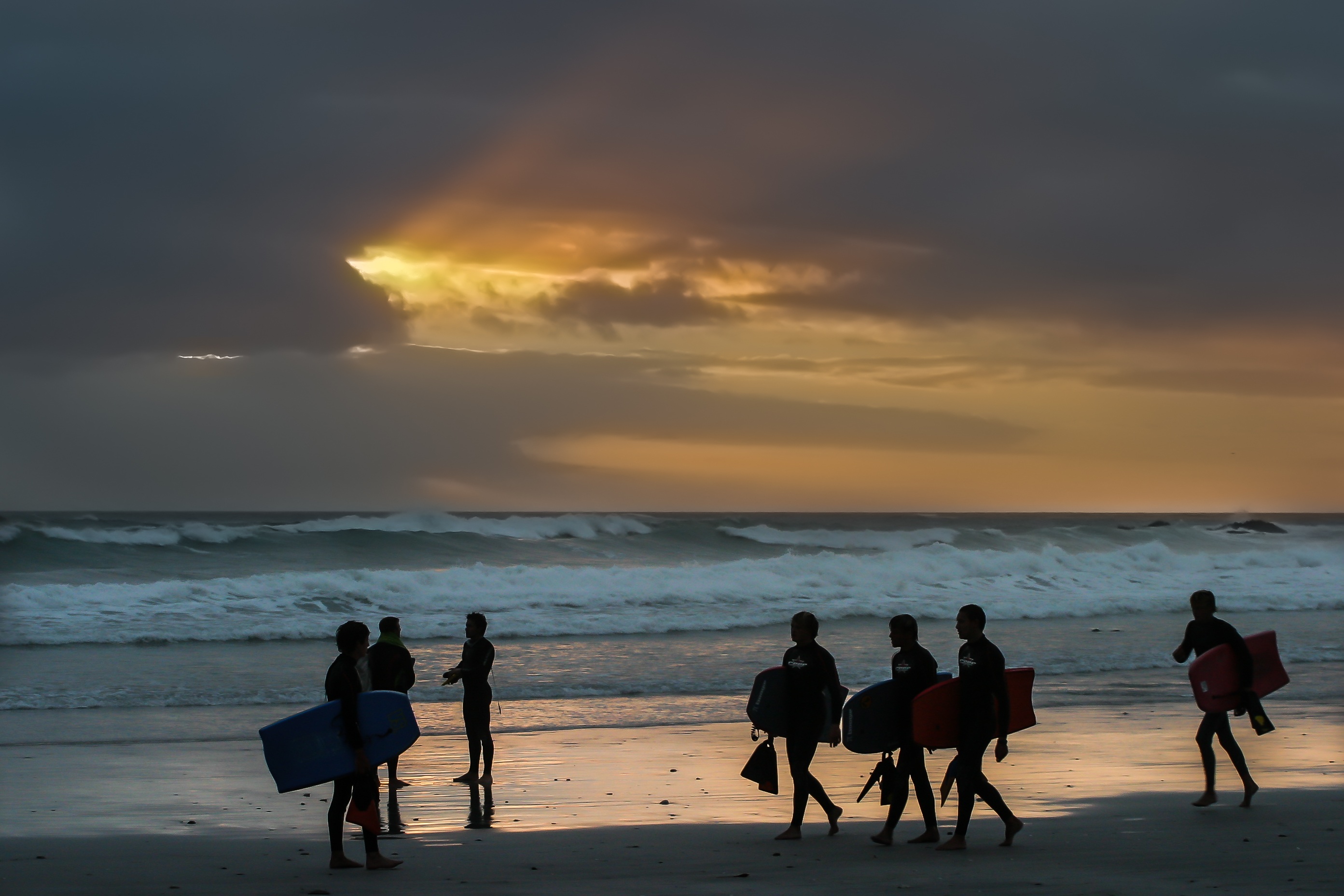 Surfers Group at Sunset free image download