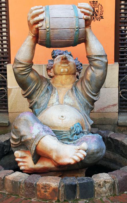Statue of a man with barrel free image download