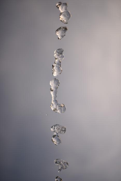 Jet of water on a gray background free image download