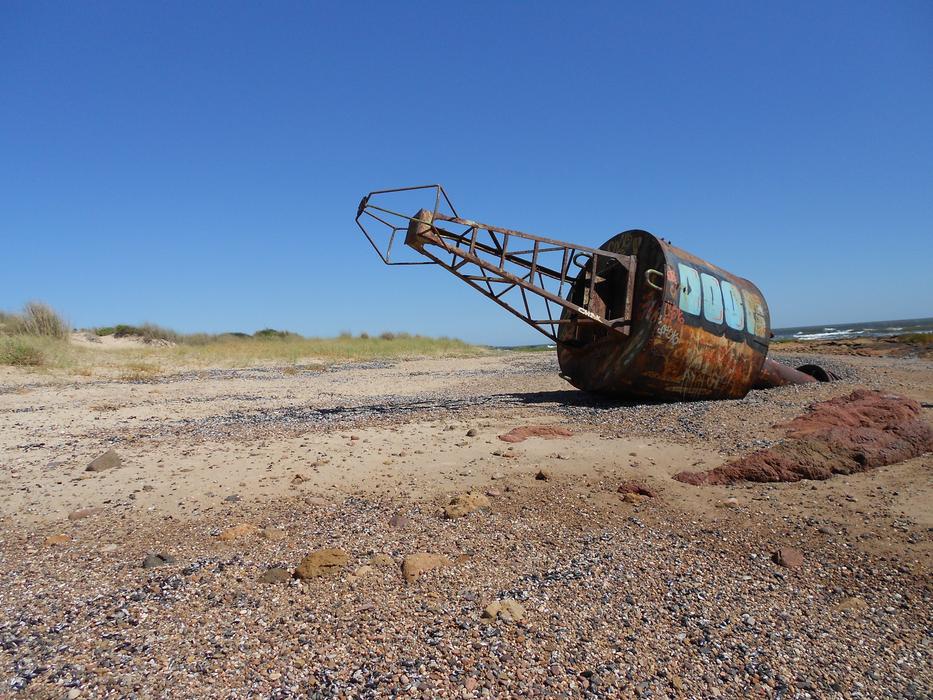 Iron buoy on the beach free image download