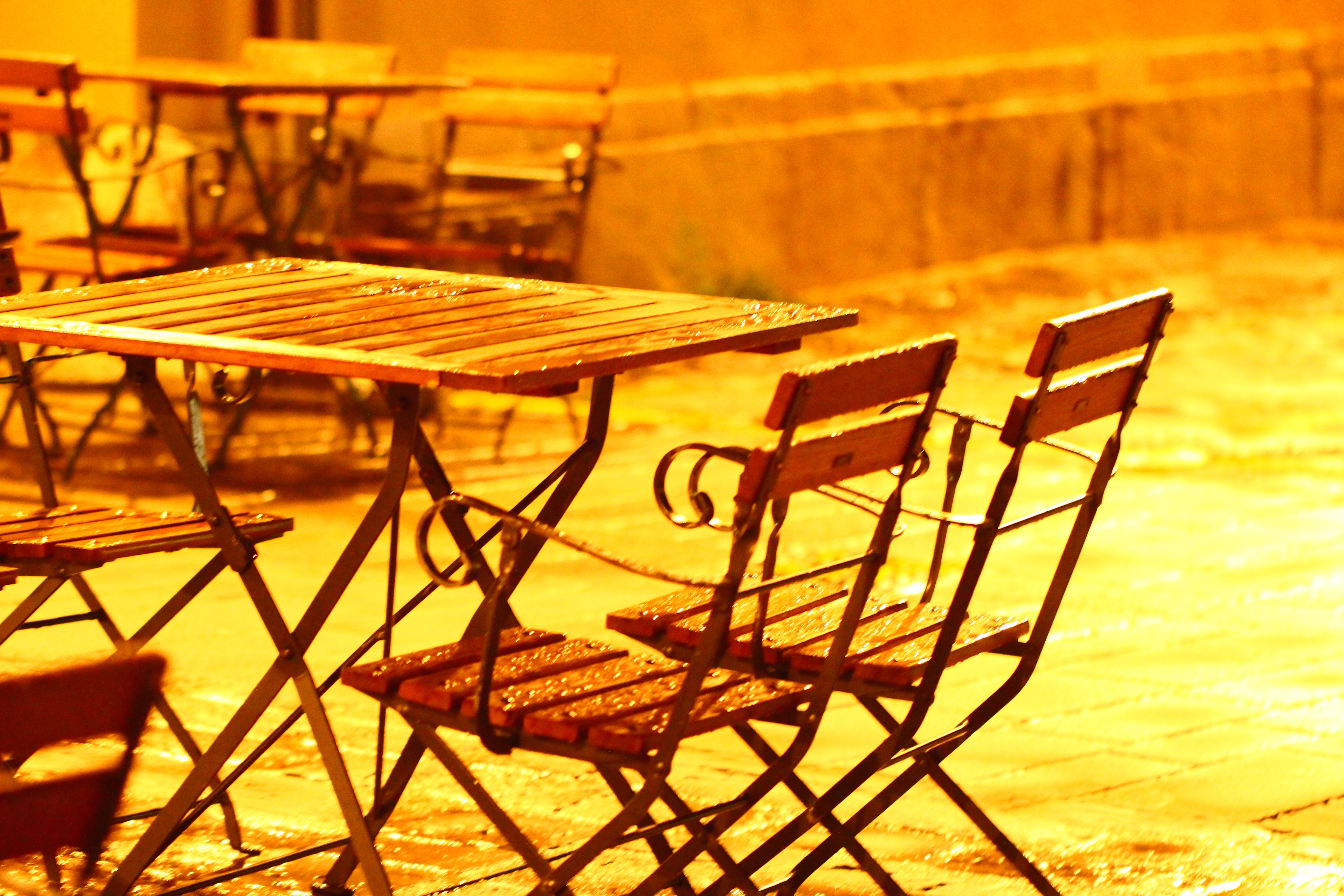 Wooden chairs with a table on the terrace free image download