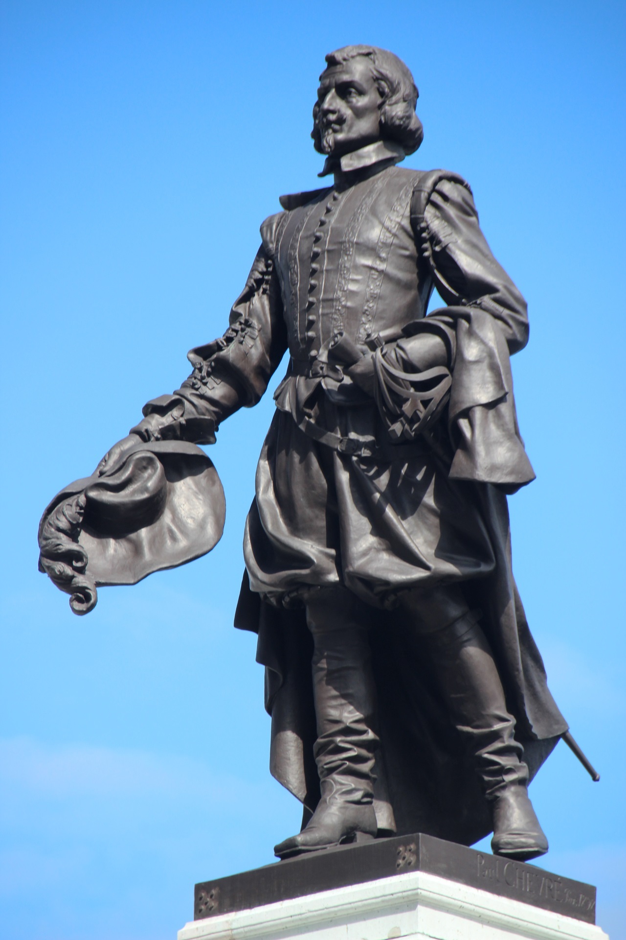 Iron statue against a clear sky free image download