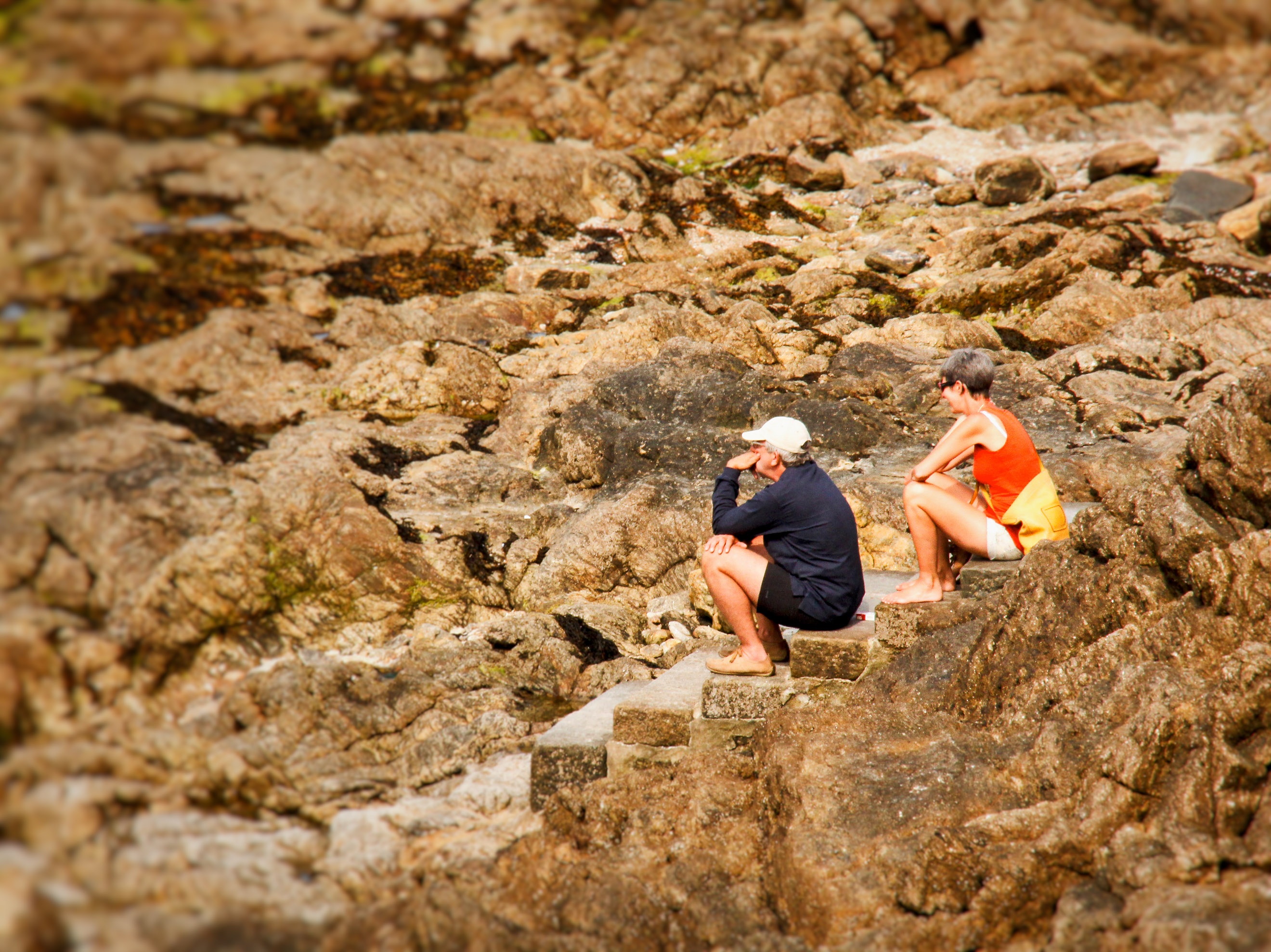 People resting on the rocks free image download