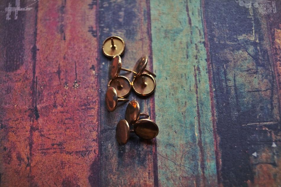 Iron buttons on a wooden table free image download