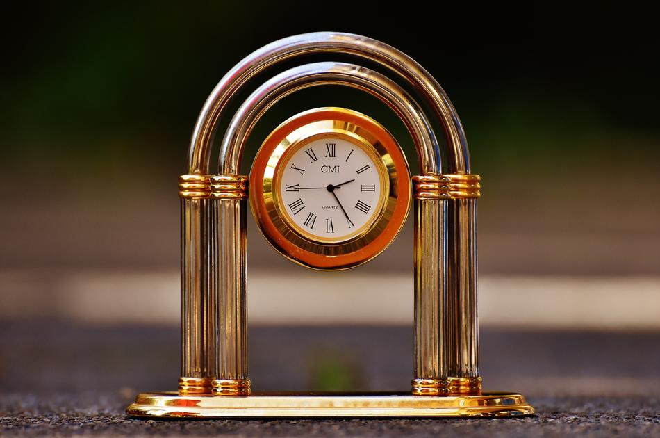 Gold clock indicating the time free image download