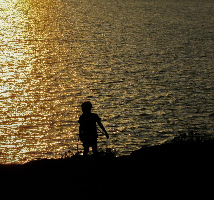 Boy Kid on coast at Sunset free image download