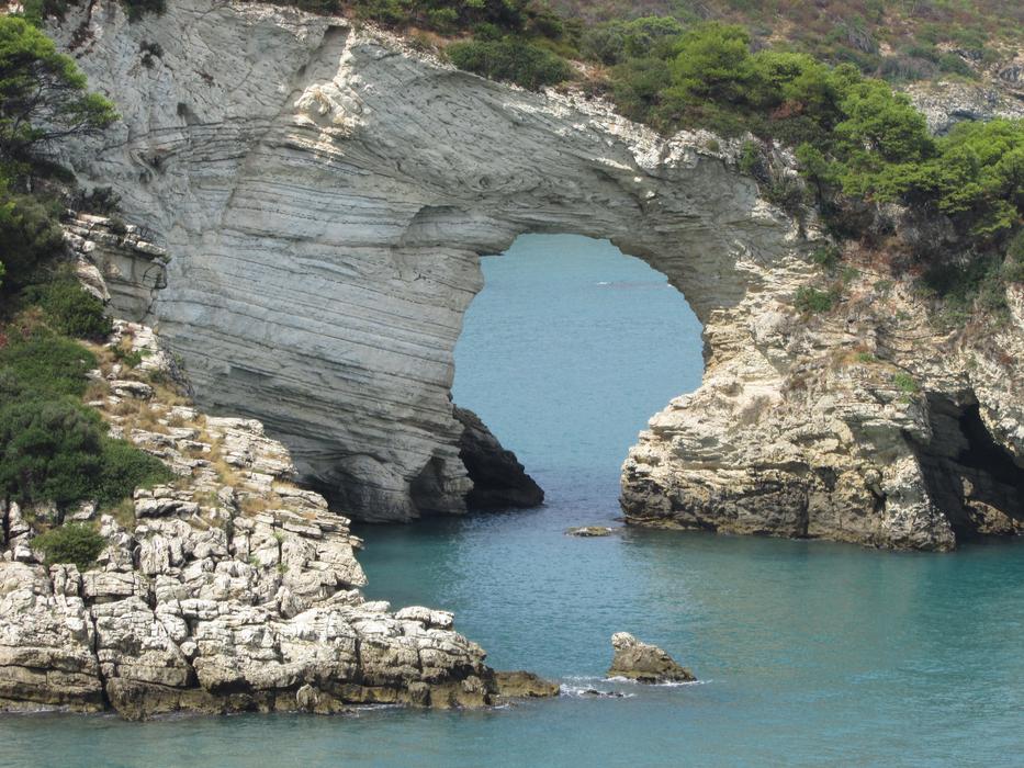 Sea view with a stone arch free image download