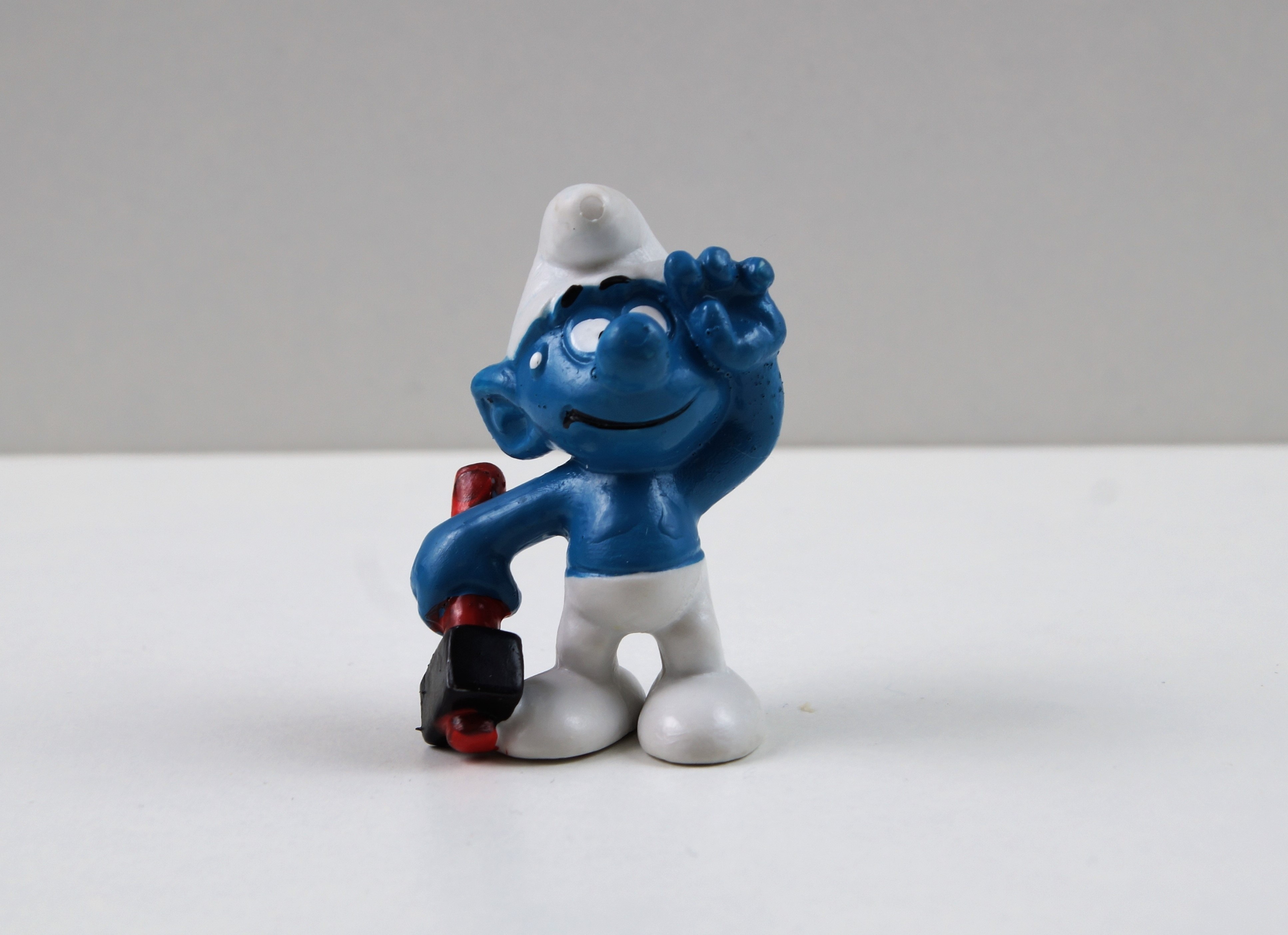 Funny smurf figurine on the table free image download