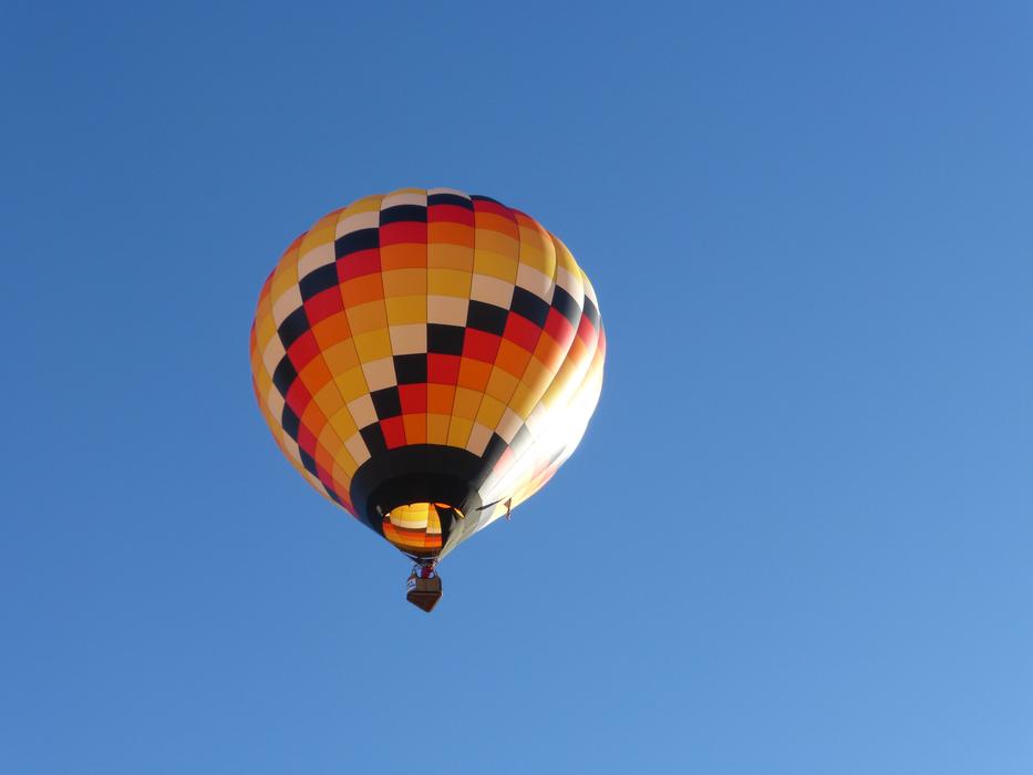 A big balloon flying in the blue sky free image download