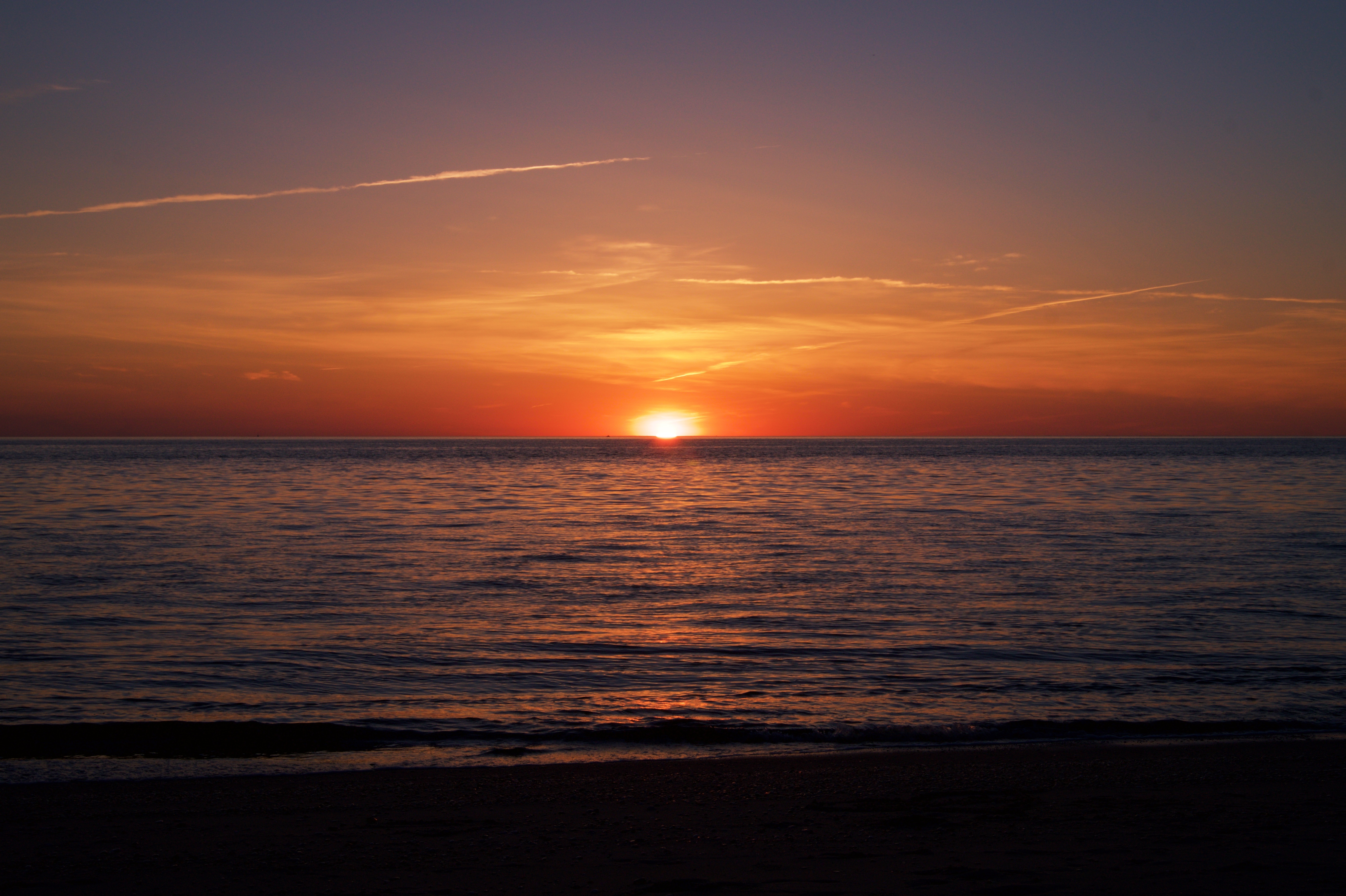 Red magical sunset by the sea free image download