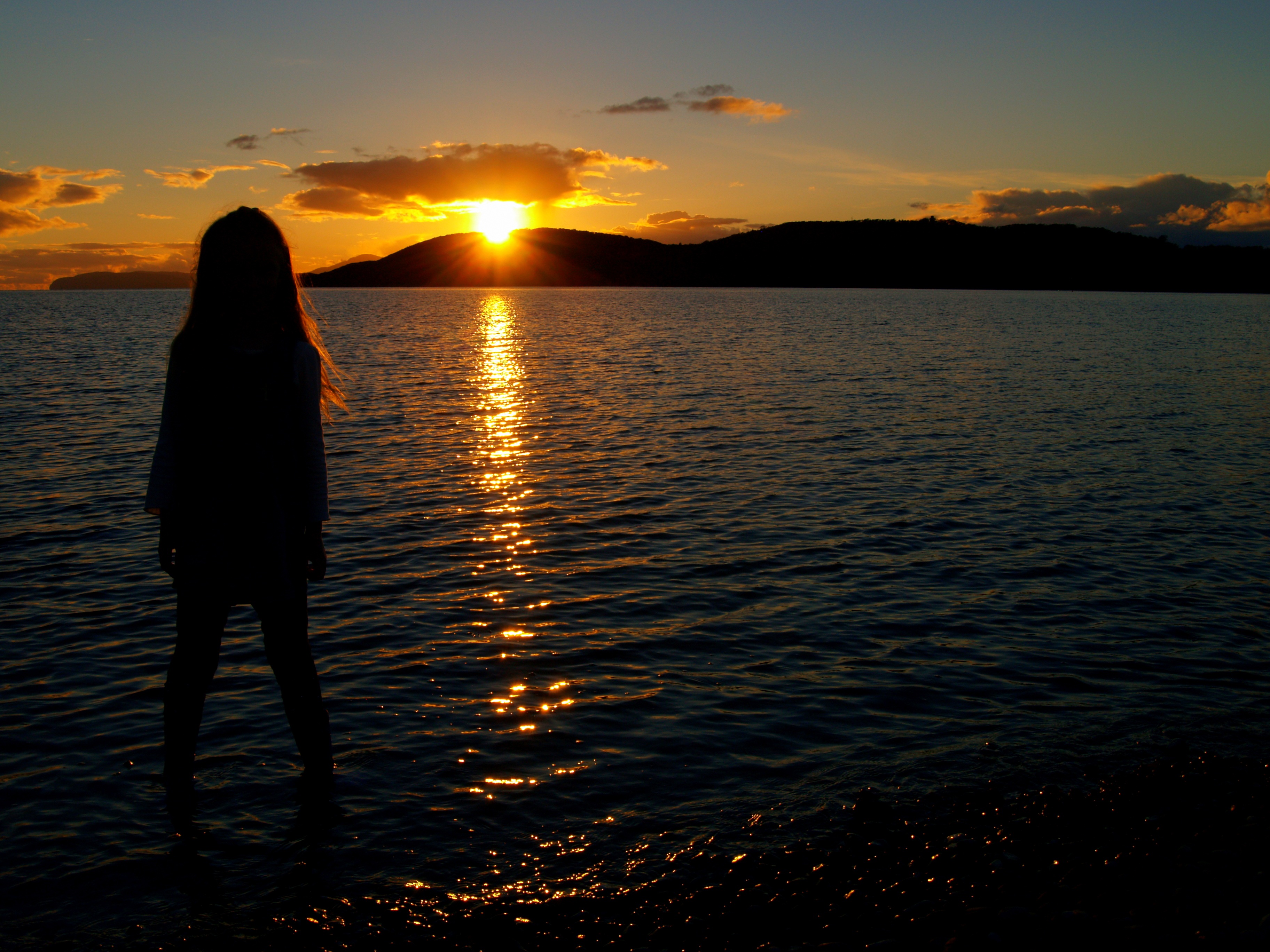 Girl silhouette at Sunset by Water free image download