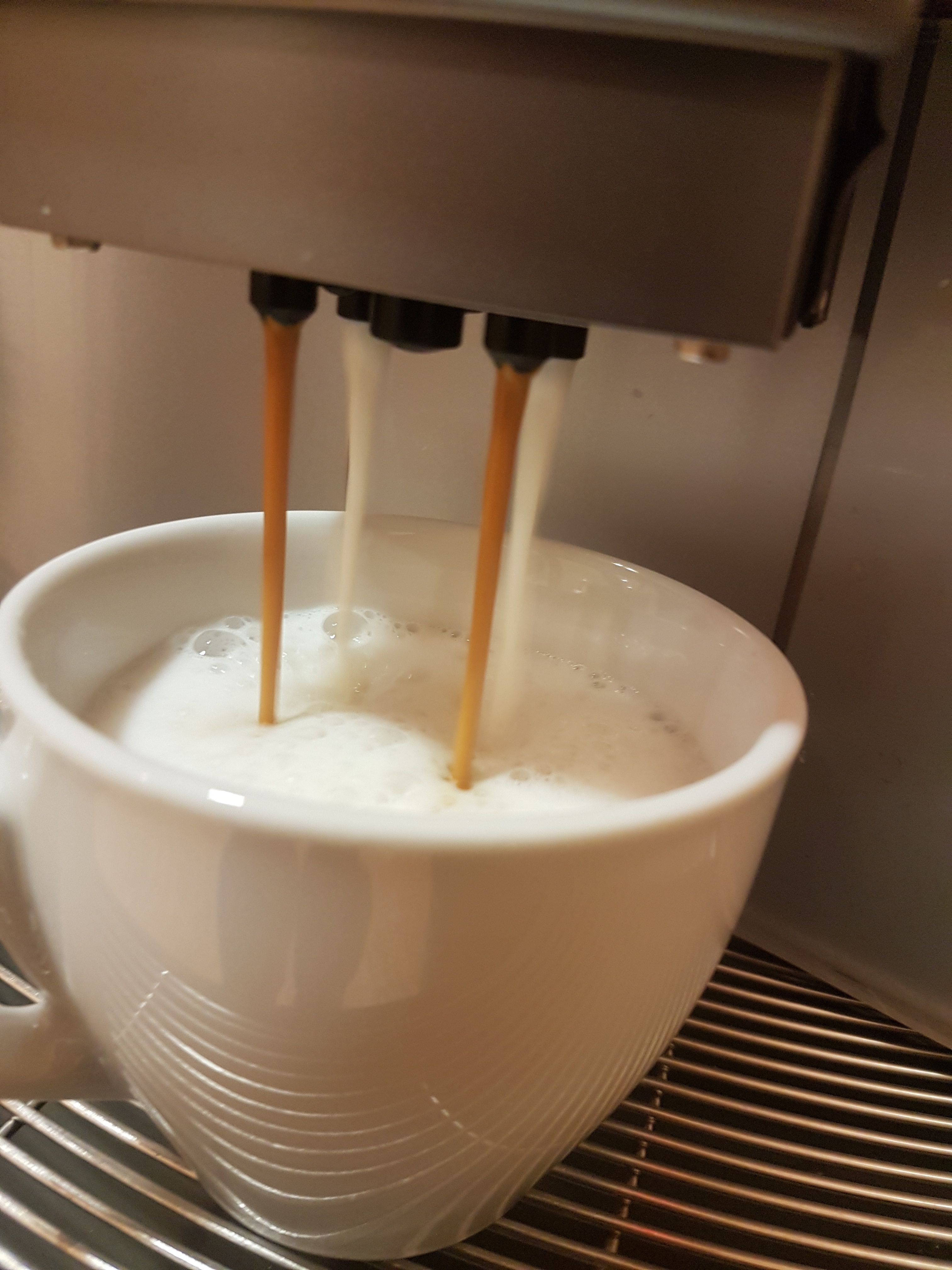 Frothy coffee in a mug free image download