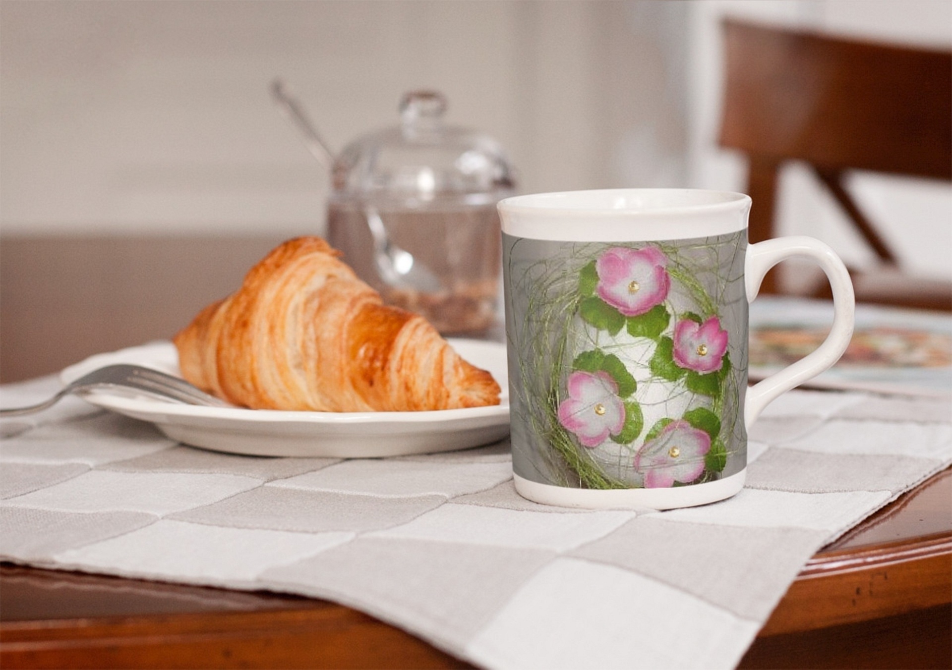 Beautiful mug with a picture of flowers and a croissant free image download