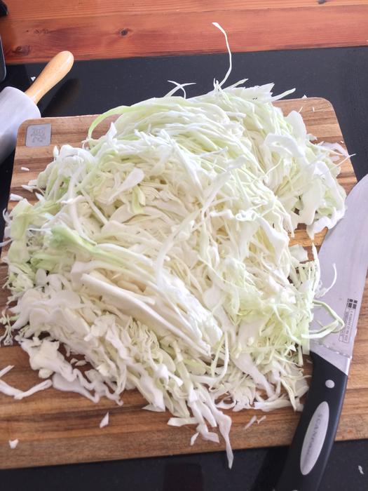 Finely chopped cabbage on a board free image download