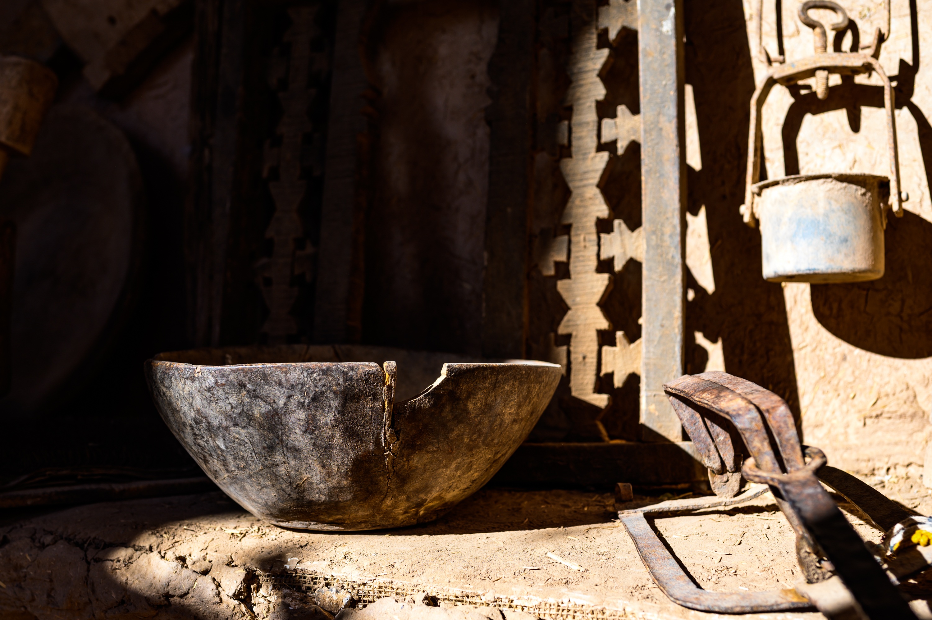 Close-up of the old bowls and tools, in light and shadow, in Kasbah in ...