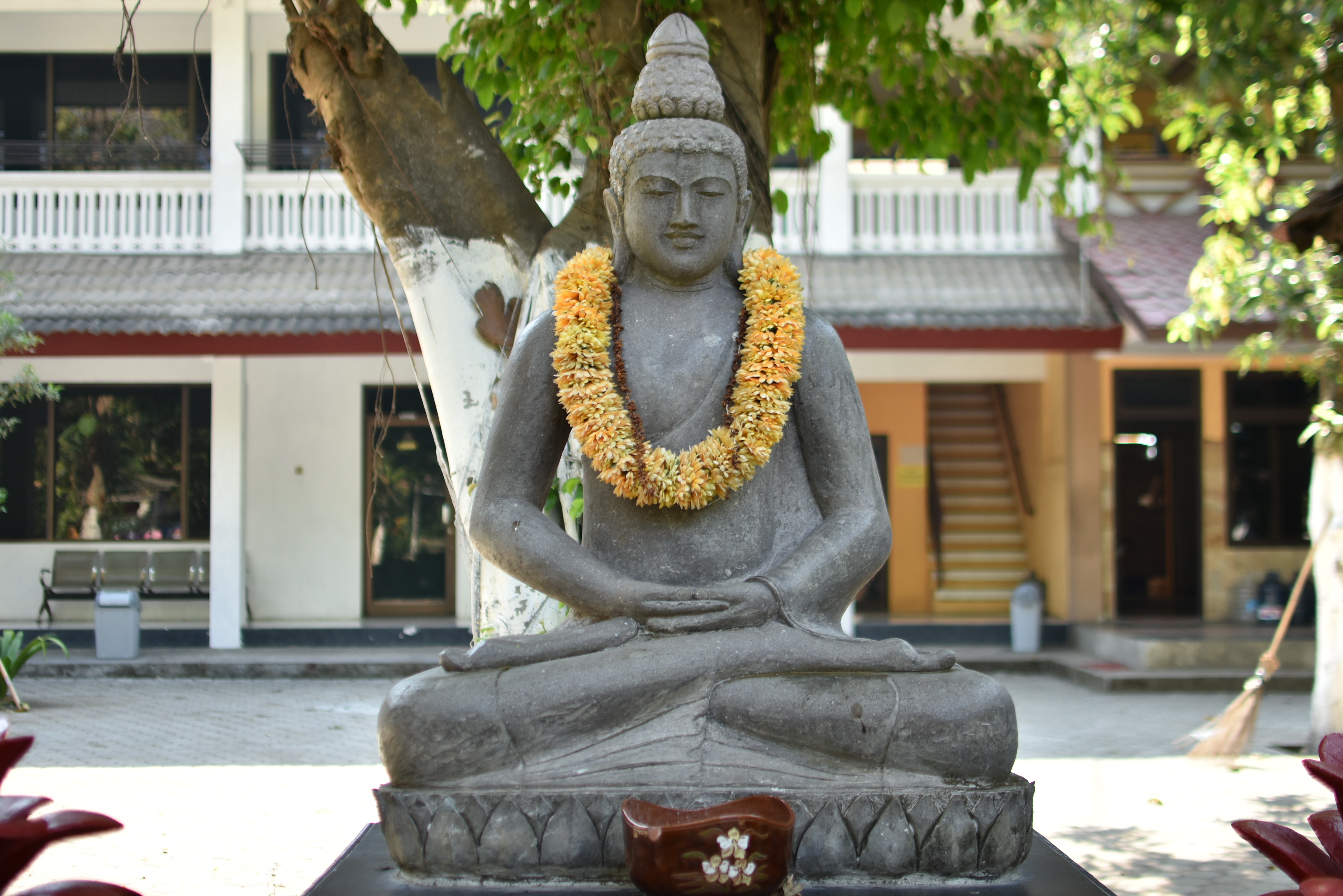 Buddha with a wreath around his neck free image download