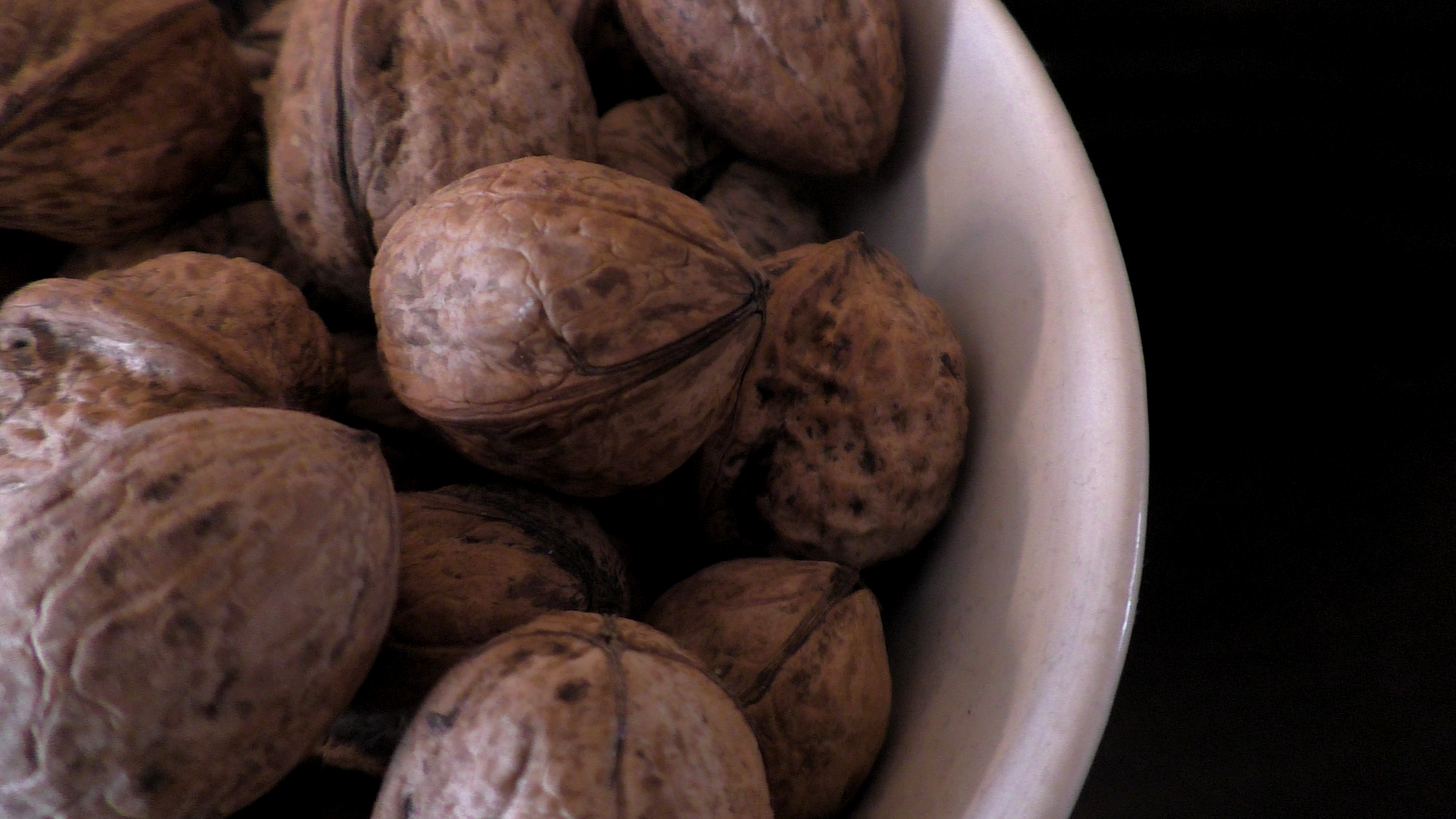 Ripe walnuts in a bowl free image download